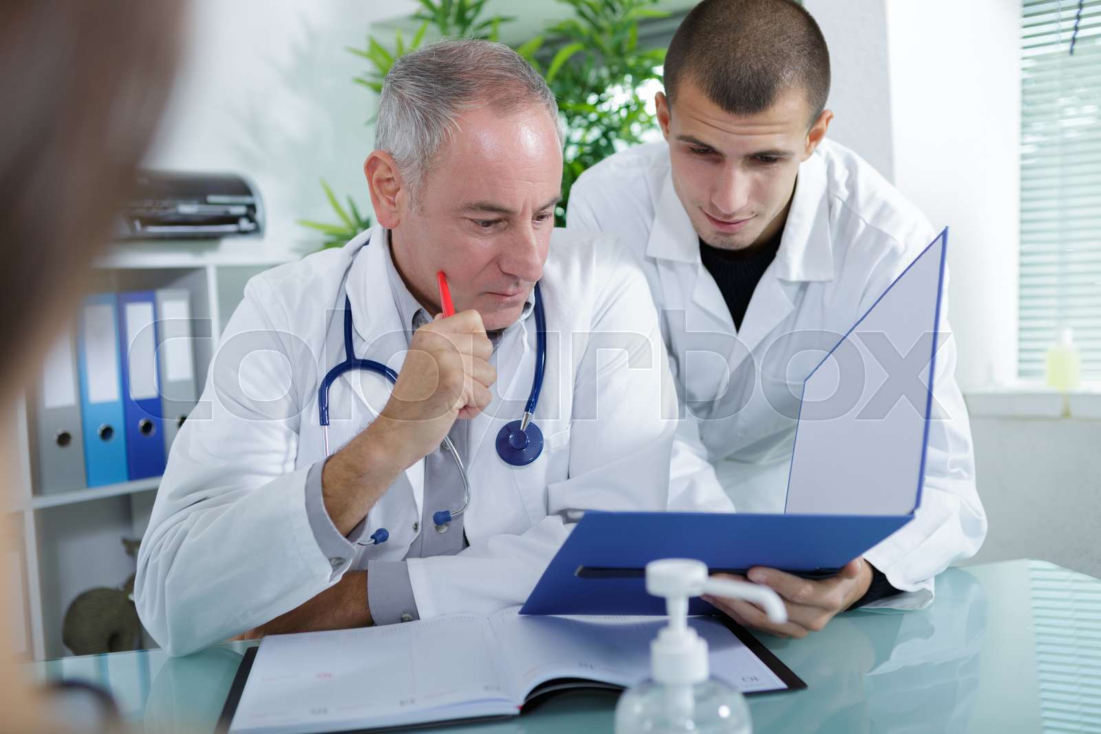doctor and student doctor is explaining something | Stock image | Colourbox