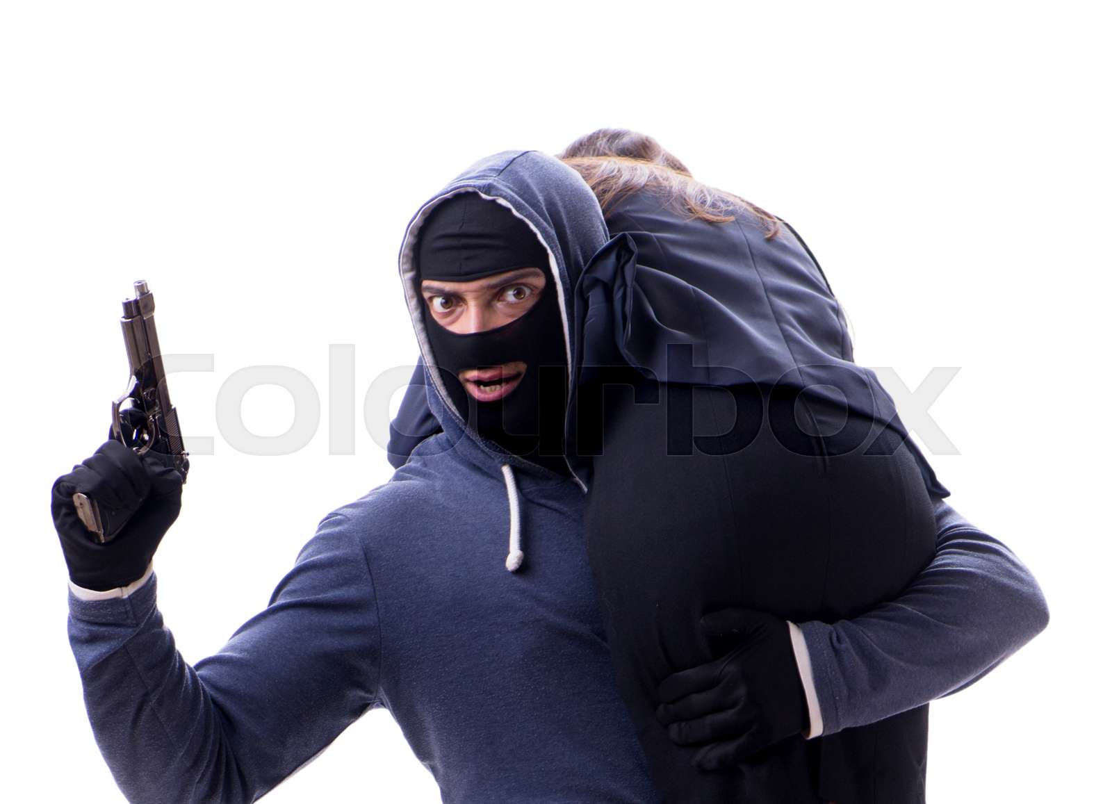 Businesswoman is kidnapped by the gunman | Stock image | Colourbox