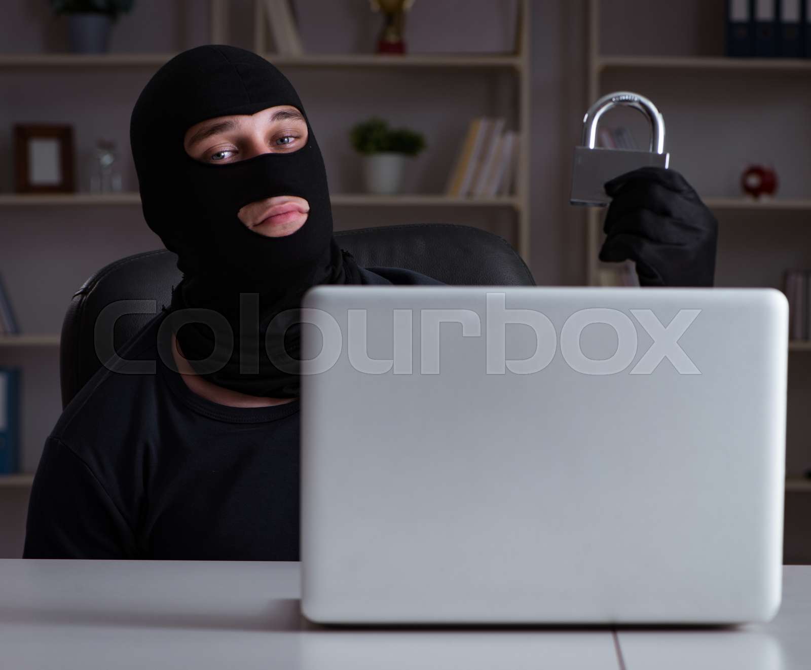 Hacker hacking computer late at night | Stock image | Colourbox