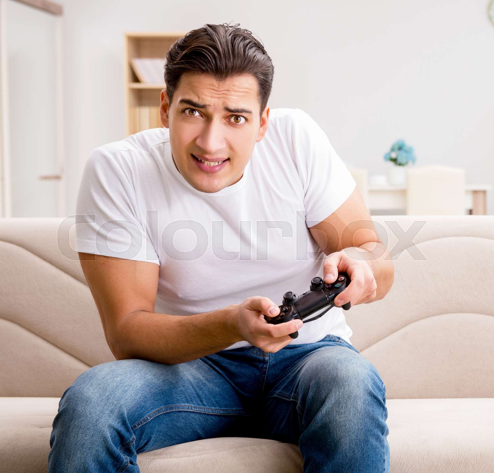 Man addicted to computer games | Stock image | Colourbox