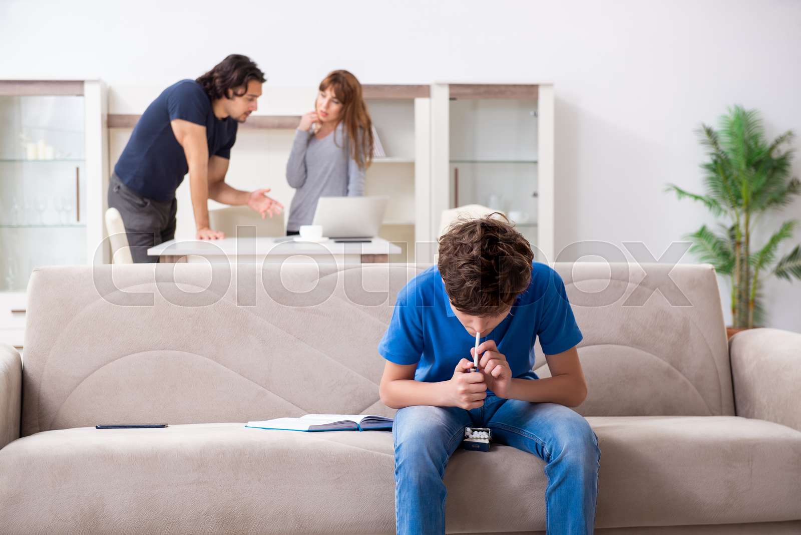 Concept of underage smoking with young boy and family | Stock image ...