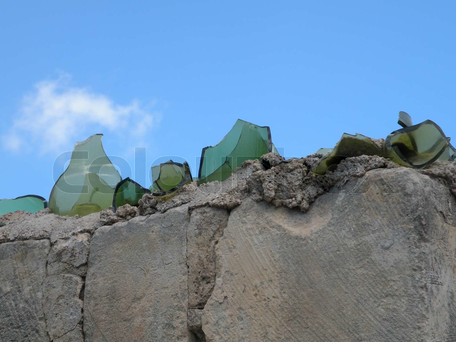 glass shard on top of a wall as fence | Stock image | Colourbox