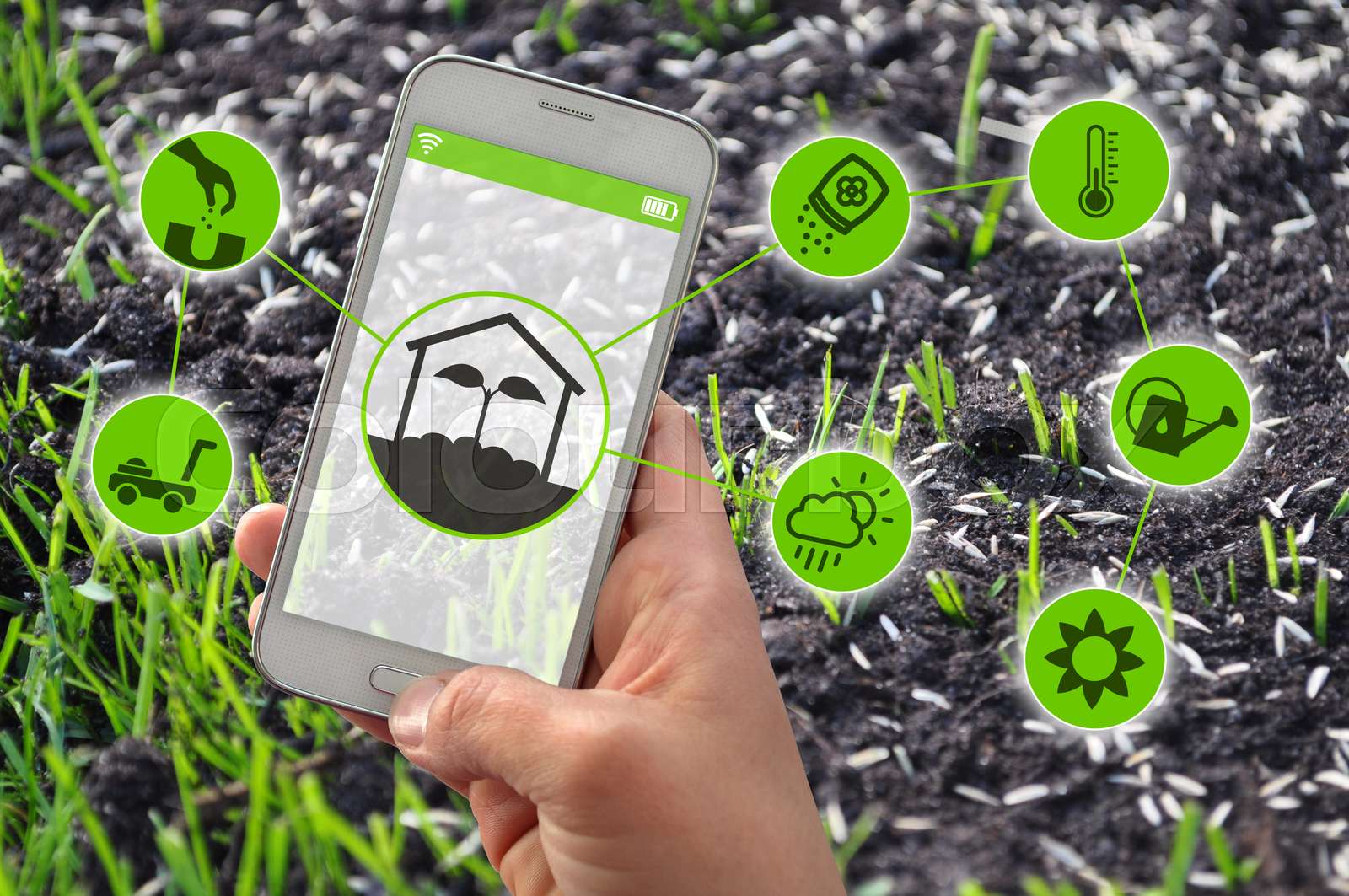 Smartphone with smart farming and smart gardening apps in front of ...