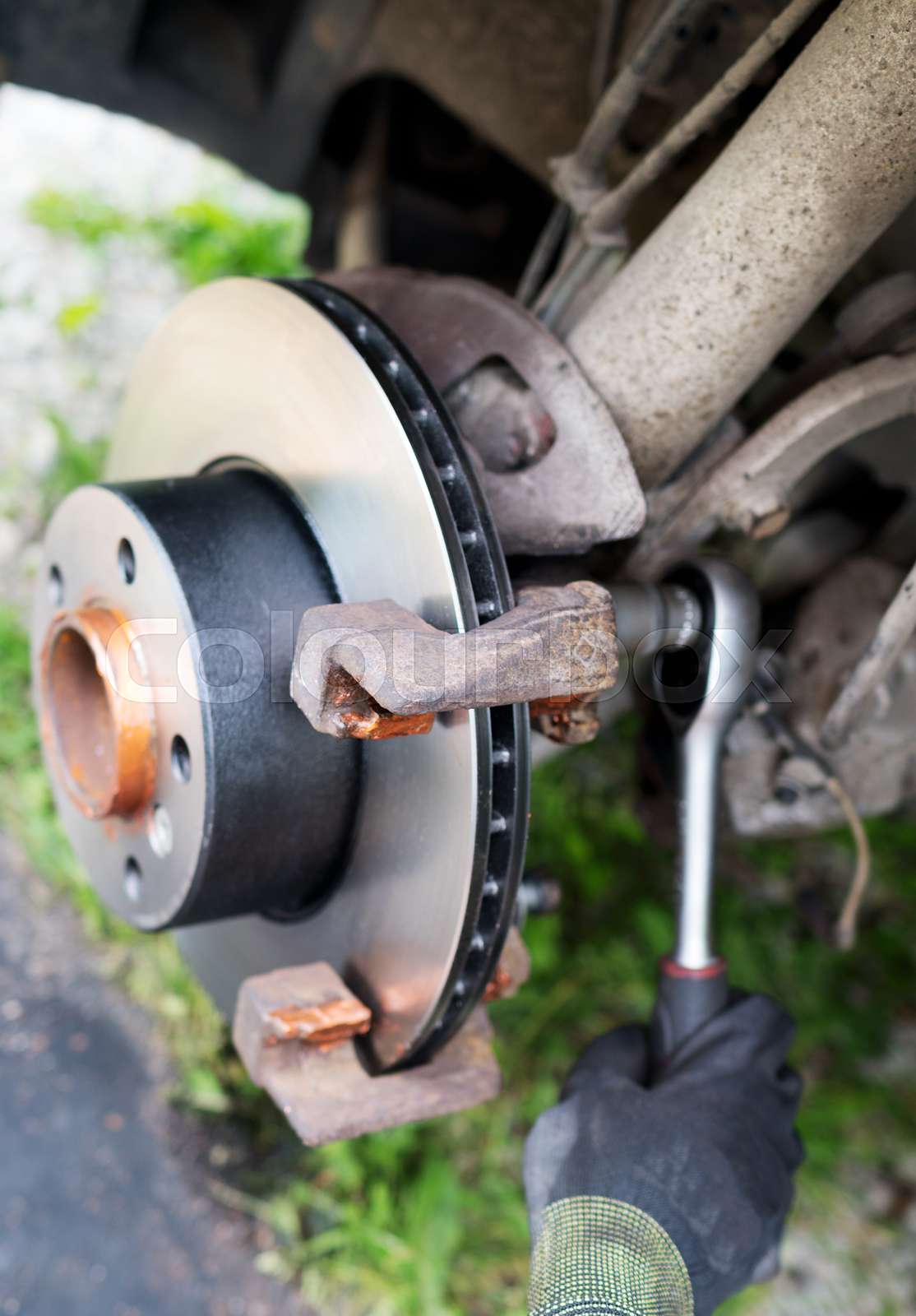 Repairing of car disc brake system. | Stock image | Colourbox