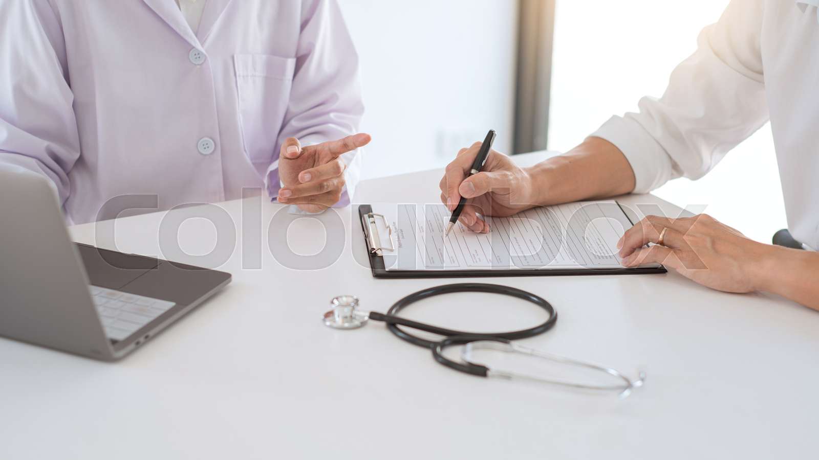 doctor giving consulting and diagnostic to patient and explaining ...