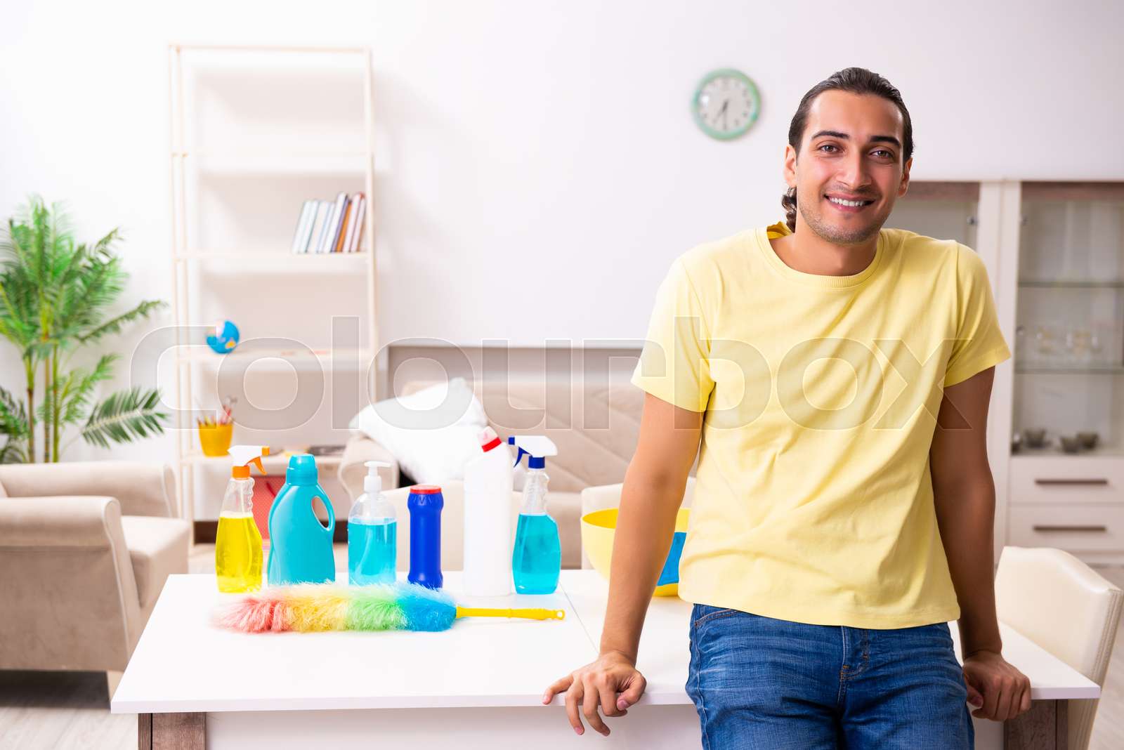Young male contractor doing housework at home | Stock image | Colourbox