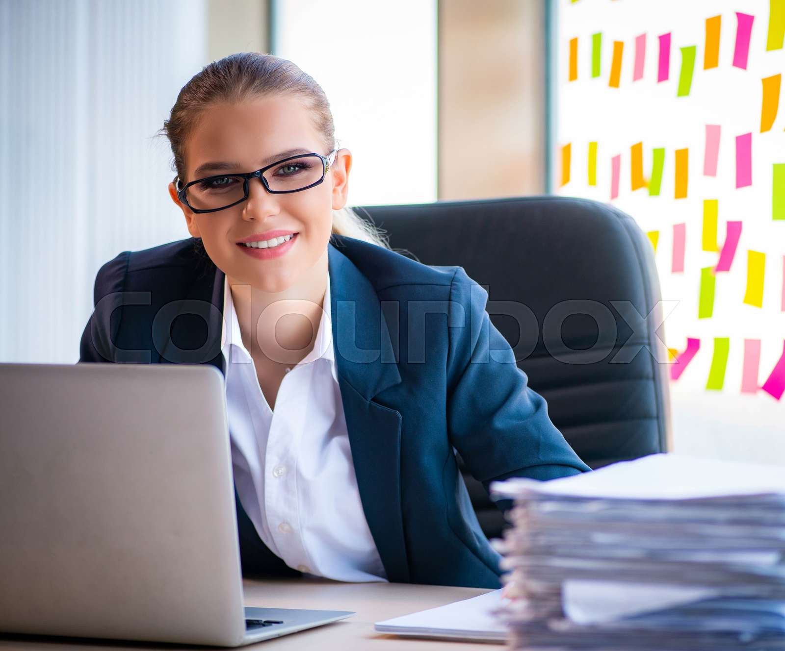 Beautiful female employee with many conflicting priorities | Stock ...