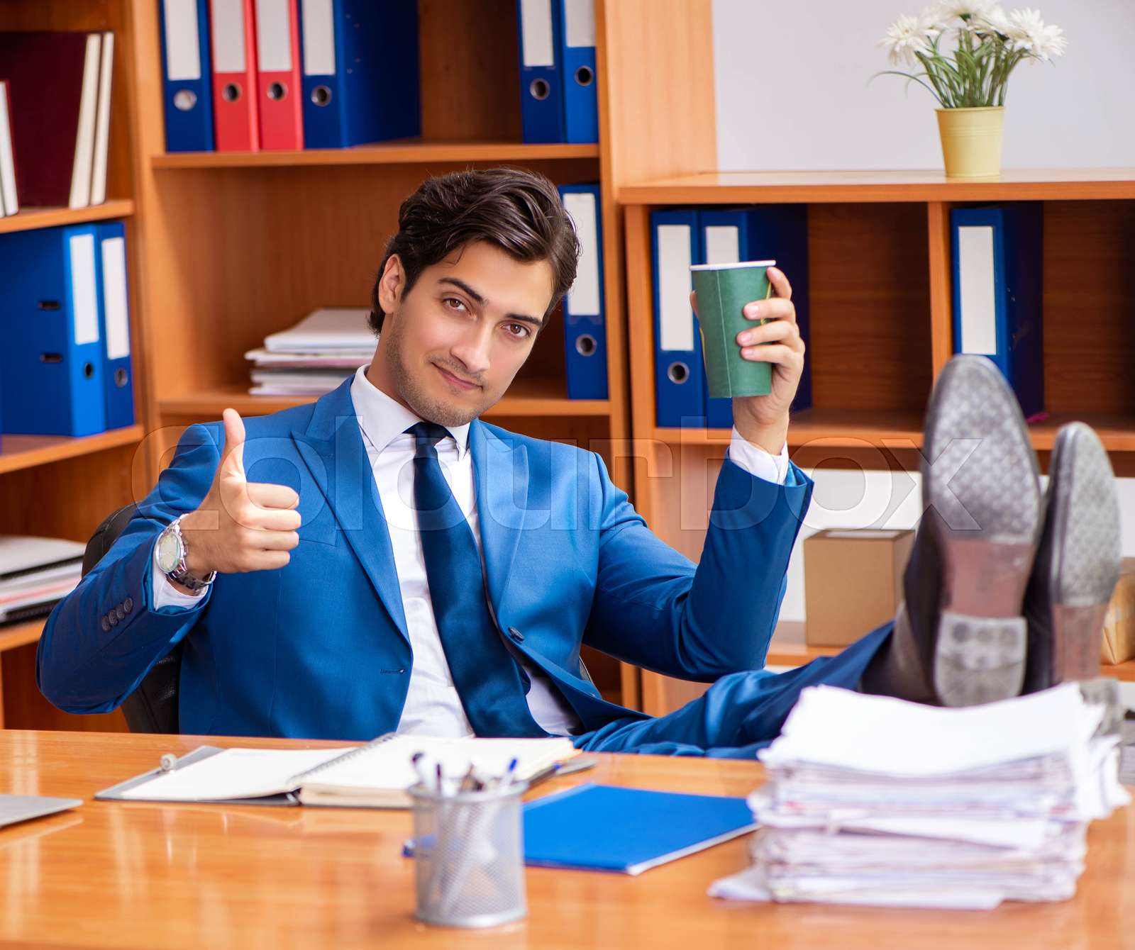 Young employee working in the office | Stock image | Colourbox