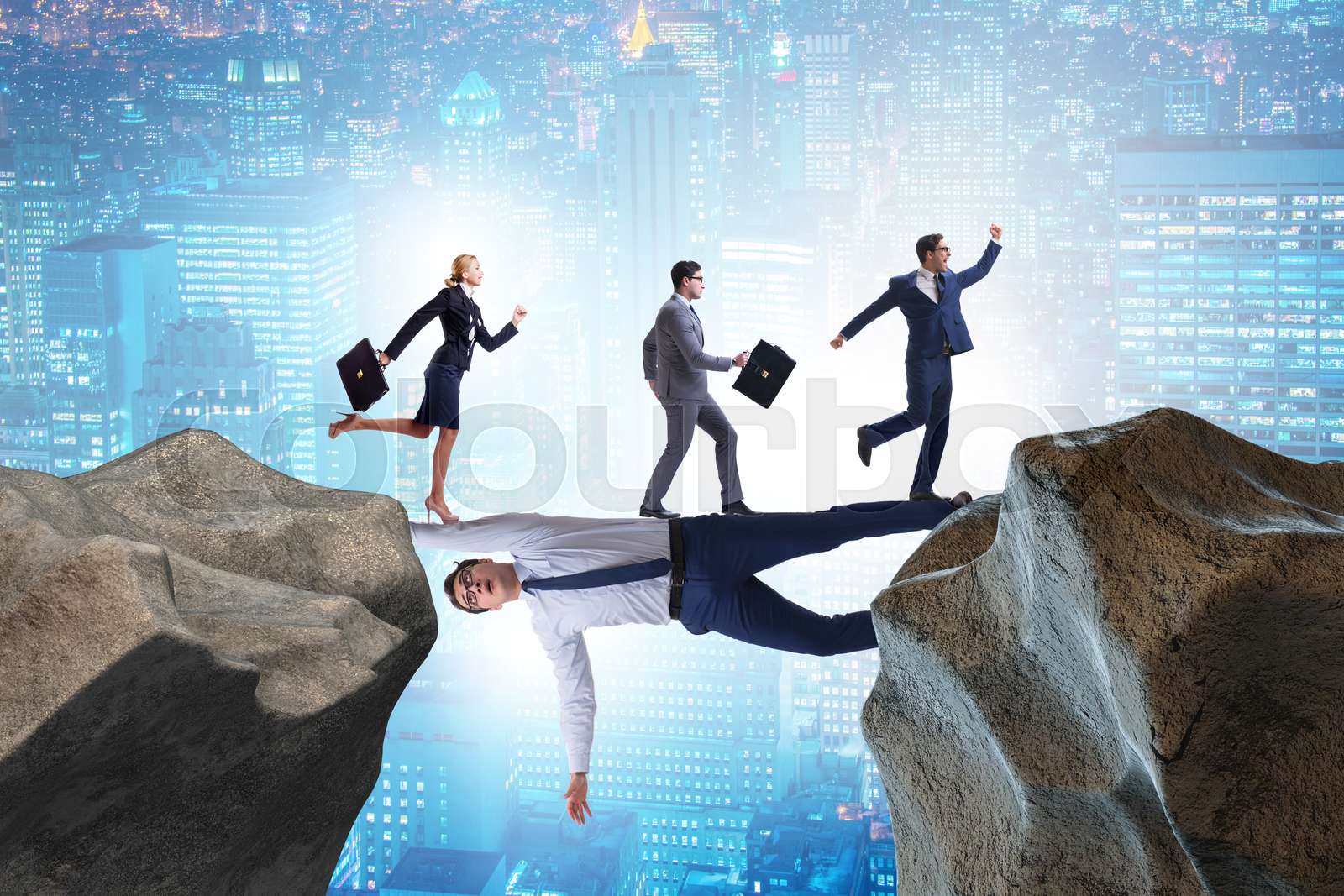 Businessman acting as a bridge in support concept | Stock image | Colourbox
