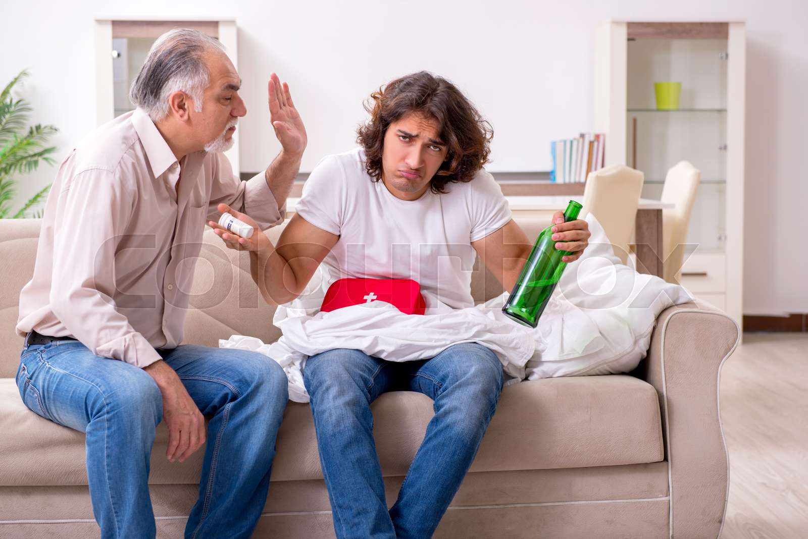 Man with drinking problem and the family | Stock image | Colourbox