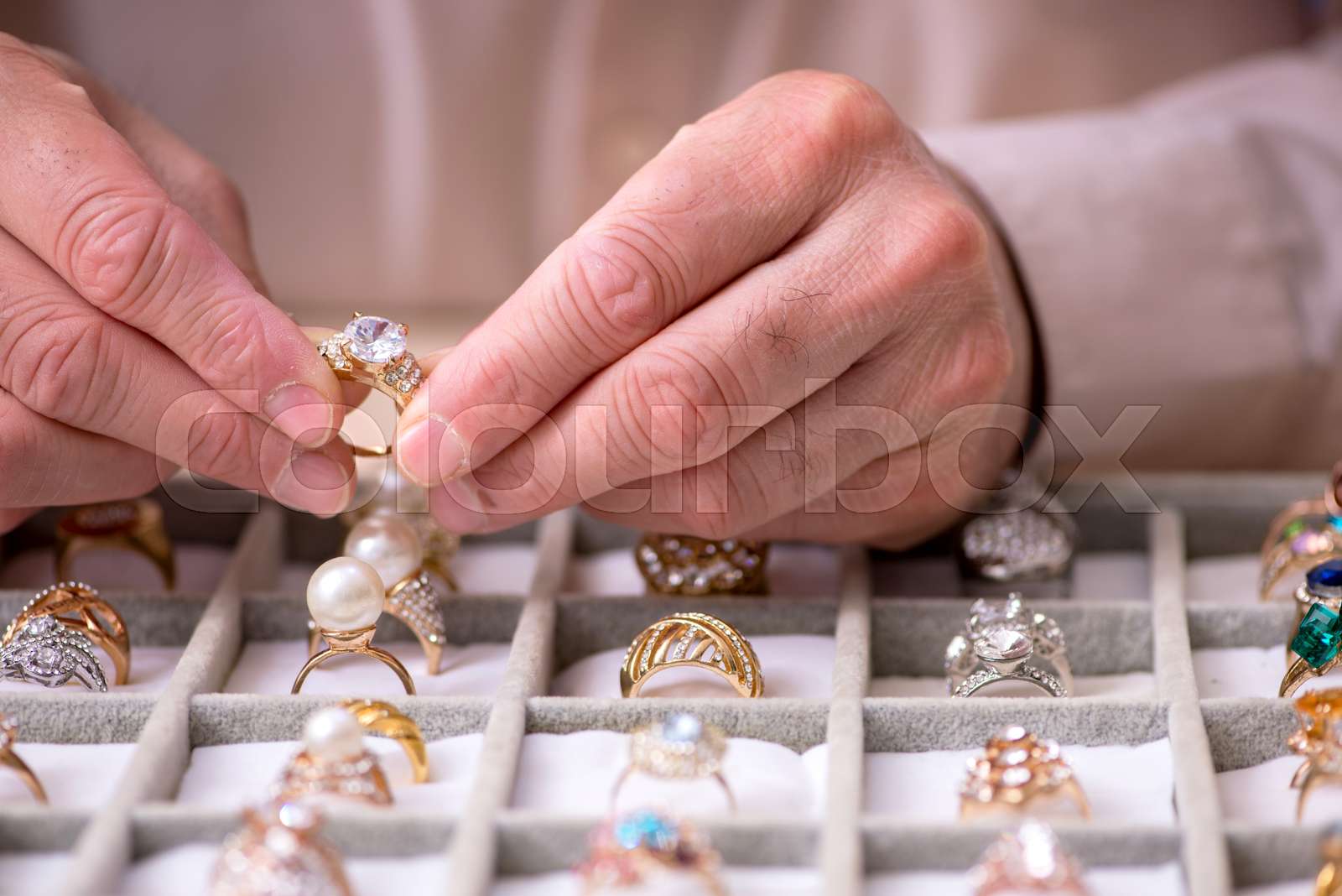 Old male jeweler at workshop | Stock image | Colourbox
