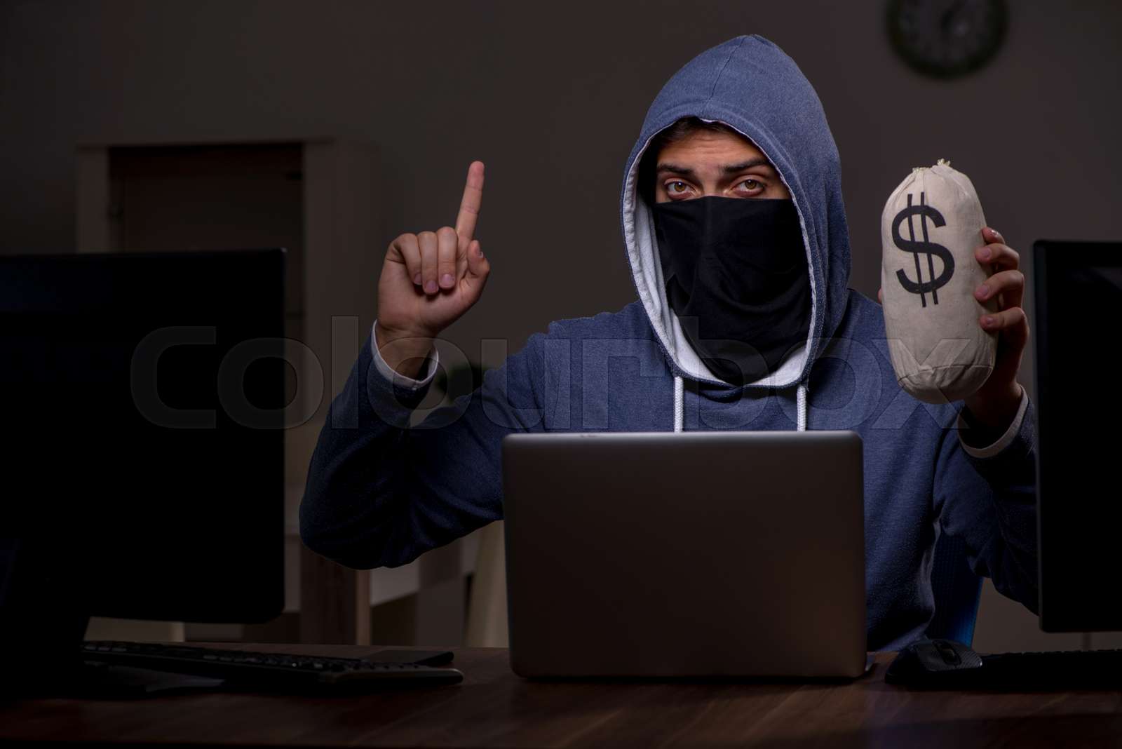 Male hacker hacking security firewall late in office | Stock image ...