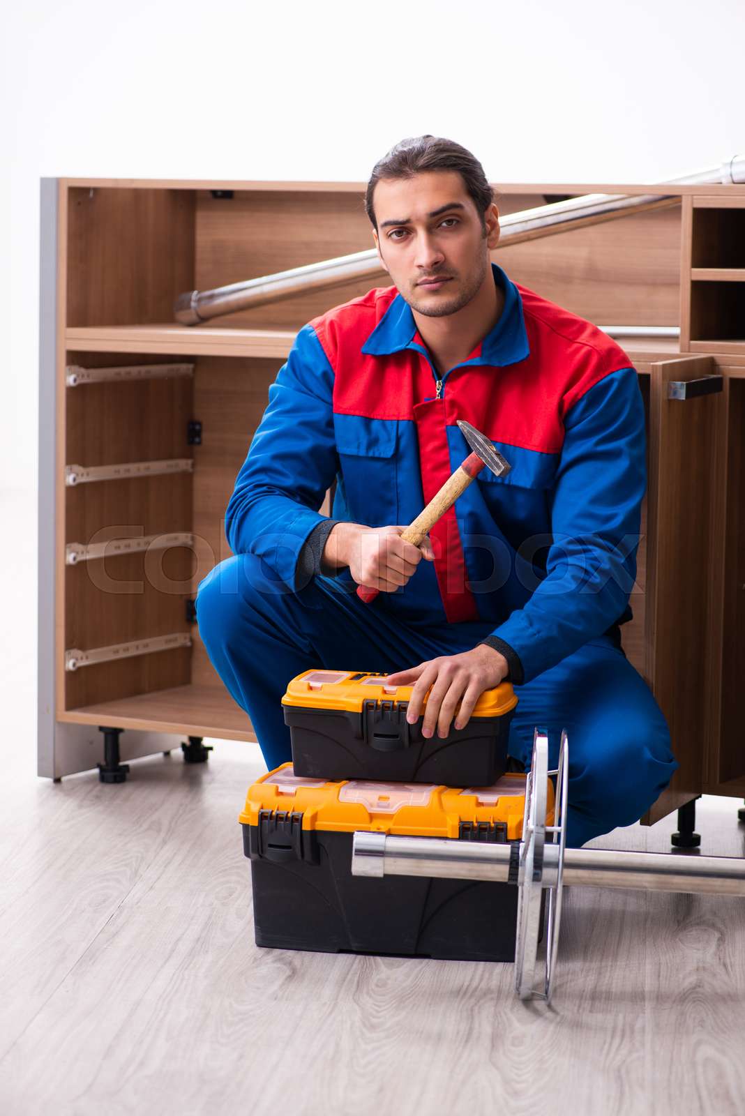 Young handsome male carpenter working indoors | Stock image | Colourbox