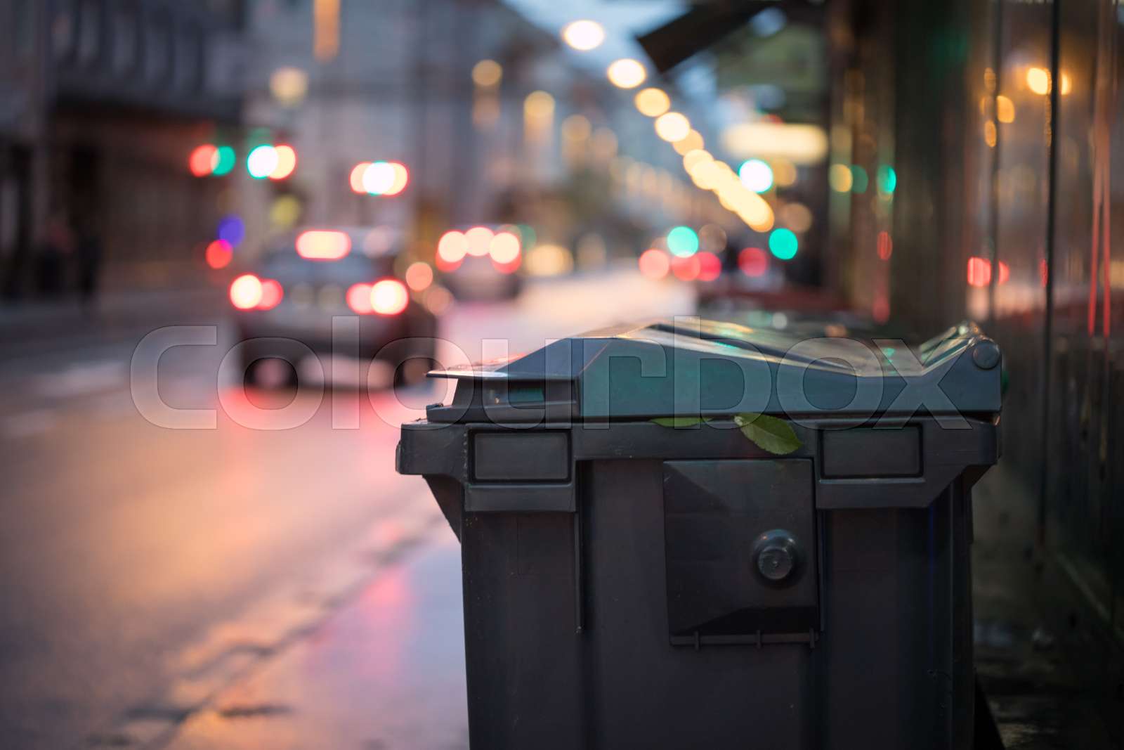 Garbage cans and street lights in urban city, evening | Stock image ...