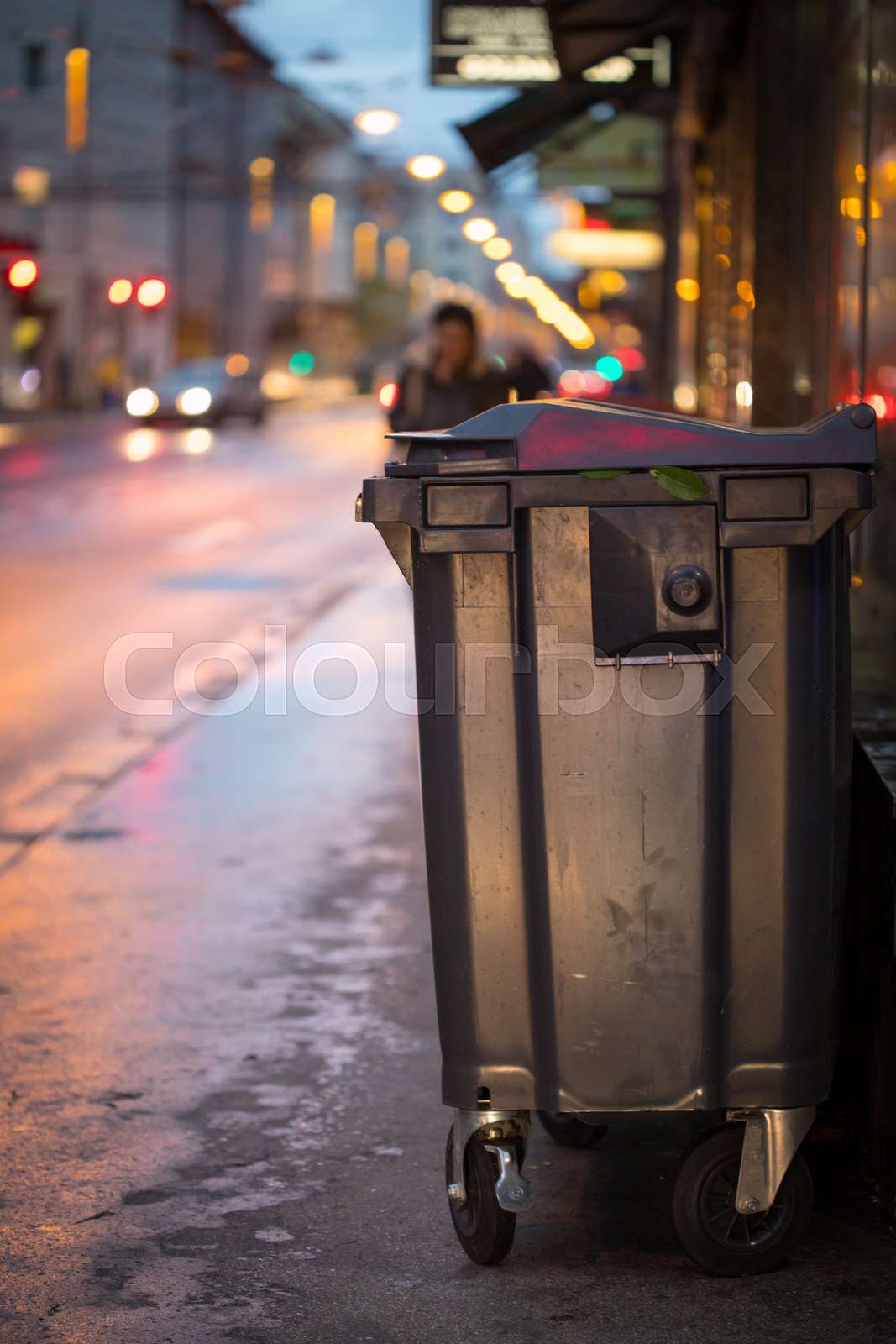 Garbage cans and street lights in urban city, evening | Stock image ...