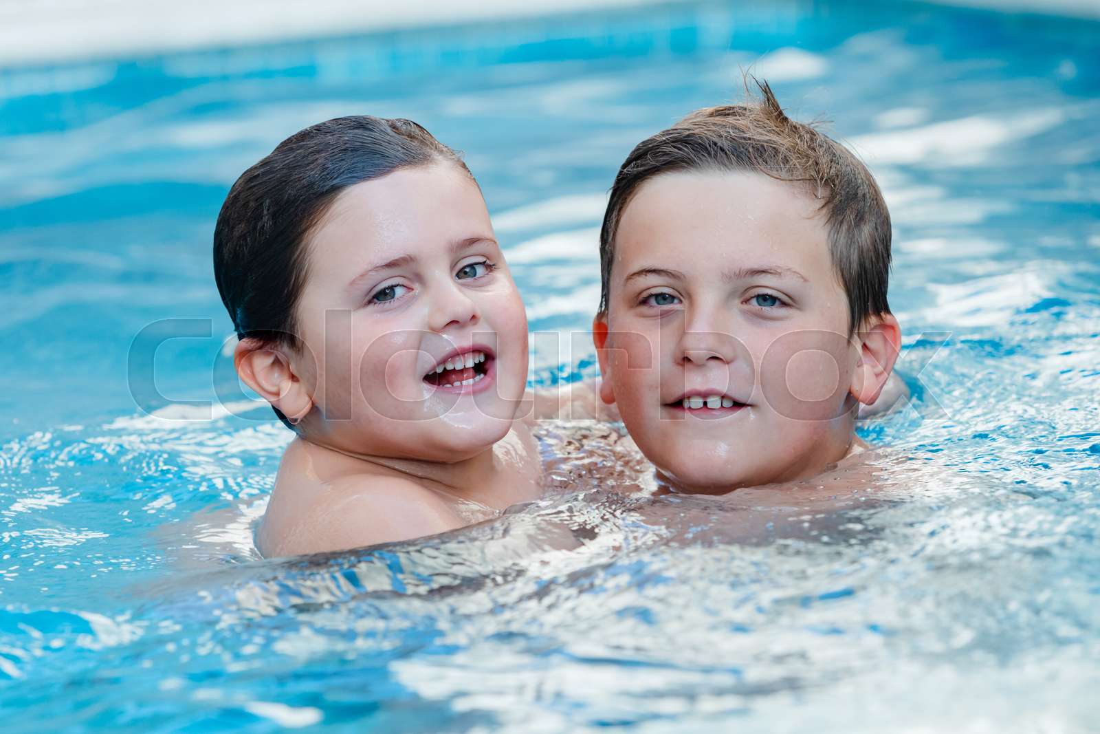 Two funny brothers in the swimming pool | Stock image | Colourbox