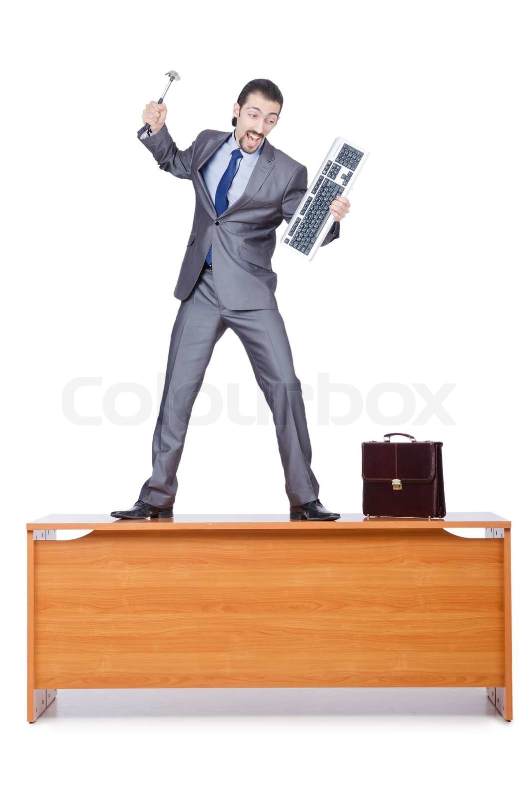 Businessman breaking his computer | Stock image | Colourbox