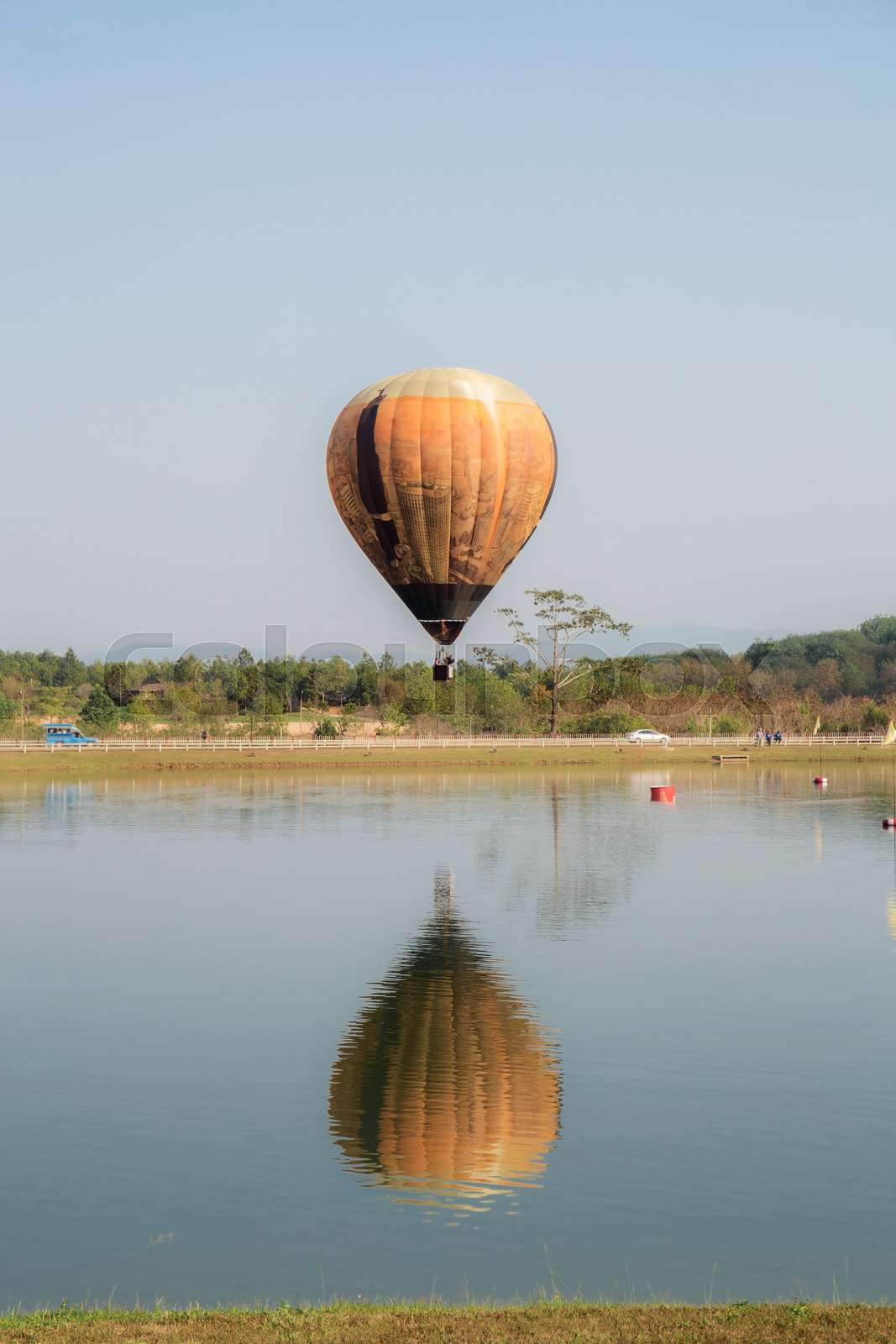 Balloon in field at lake. | Stock image | Colourbox