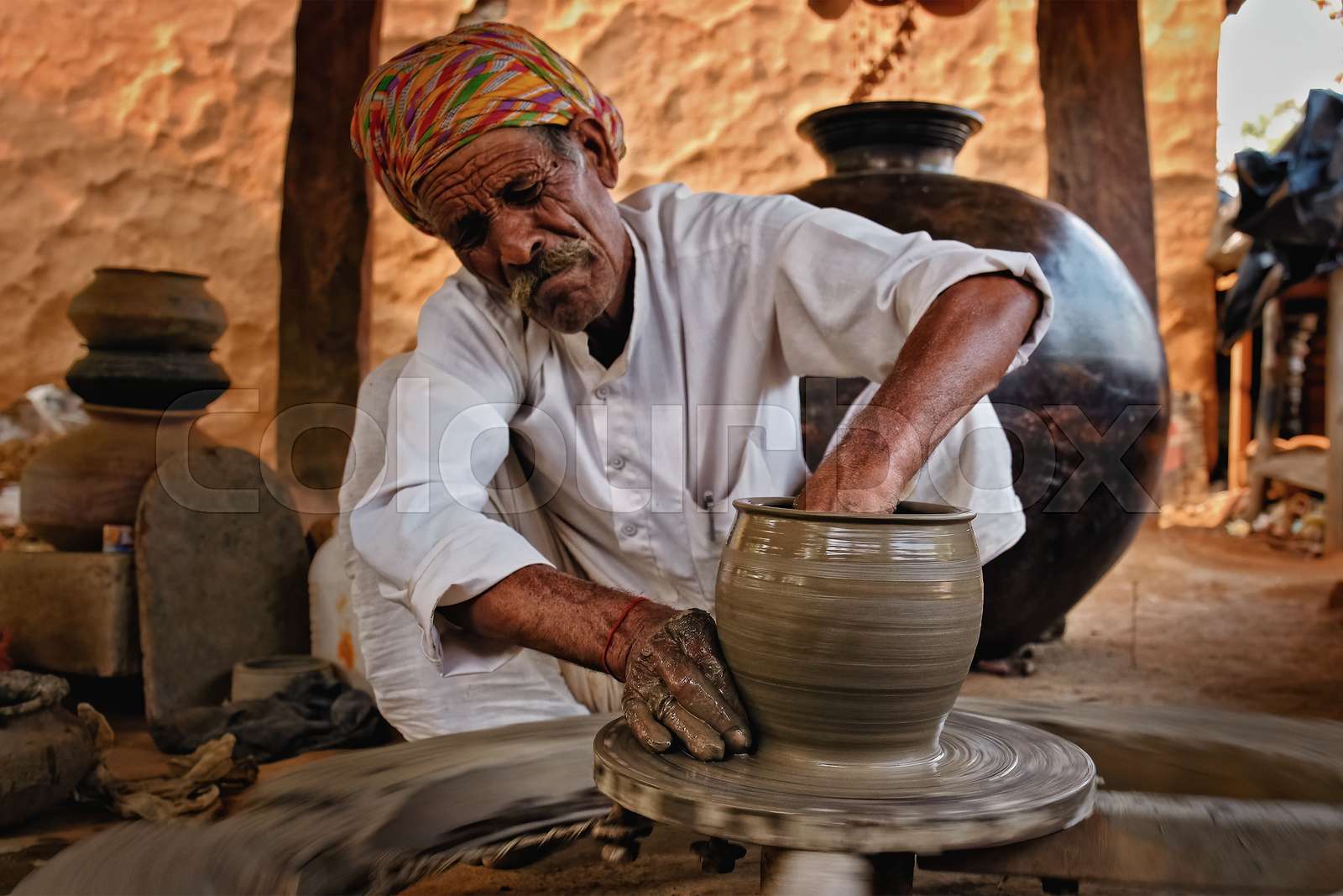 Indian potter at work. Handwork craft from Shilpagram, Udaipur ...
