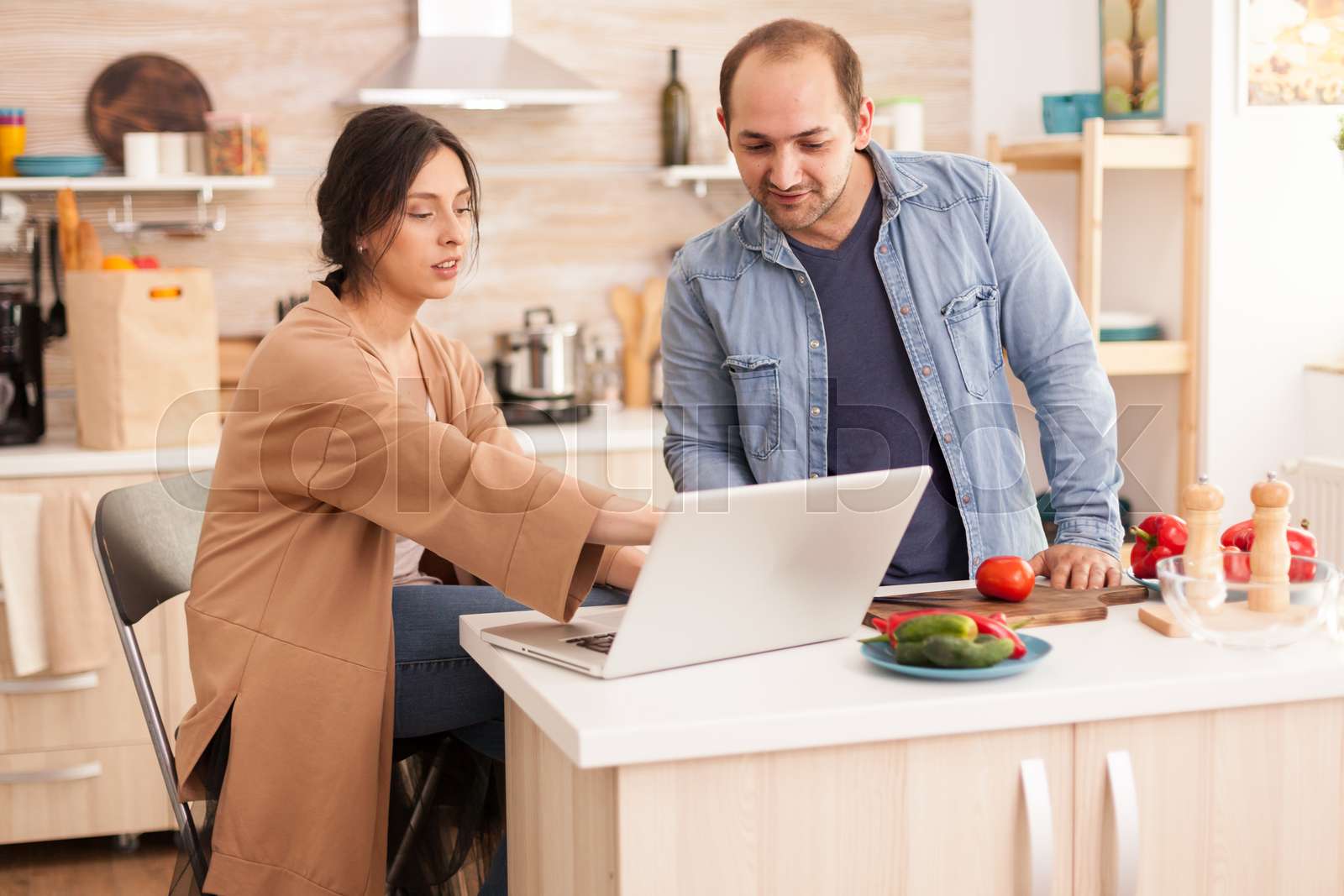 Couple watching recipe tutorial | Stock image | Colourbox