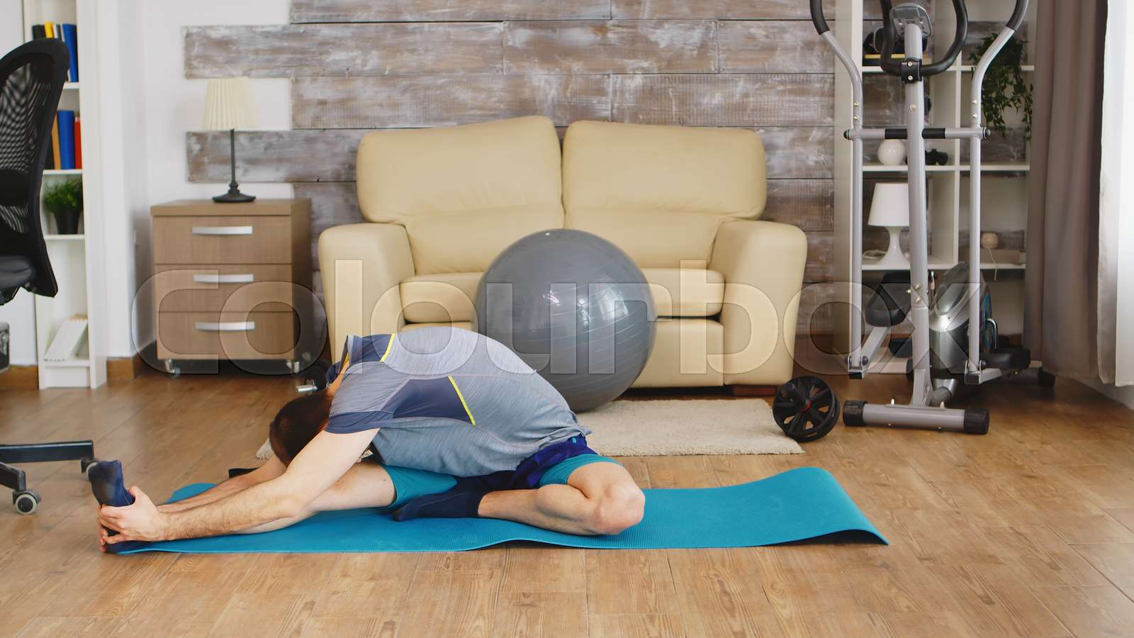 Home stretching exercise | Stock image | Colourbox