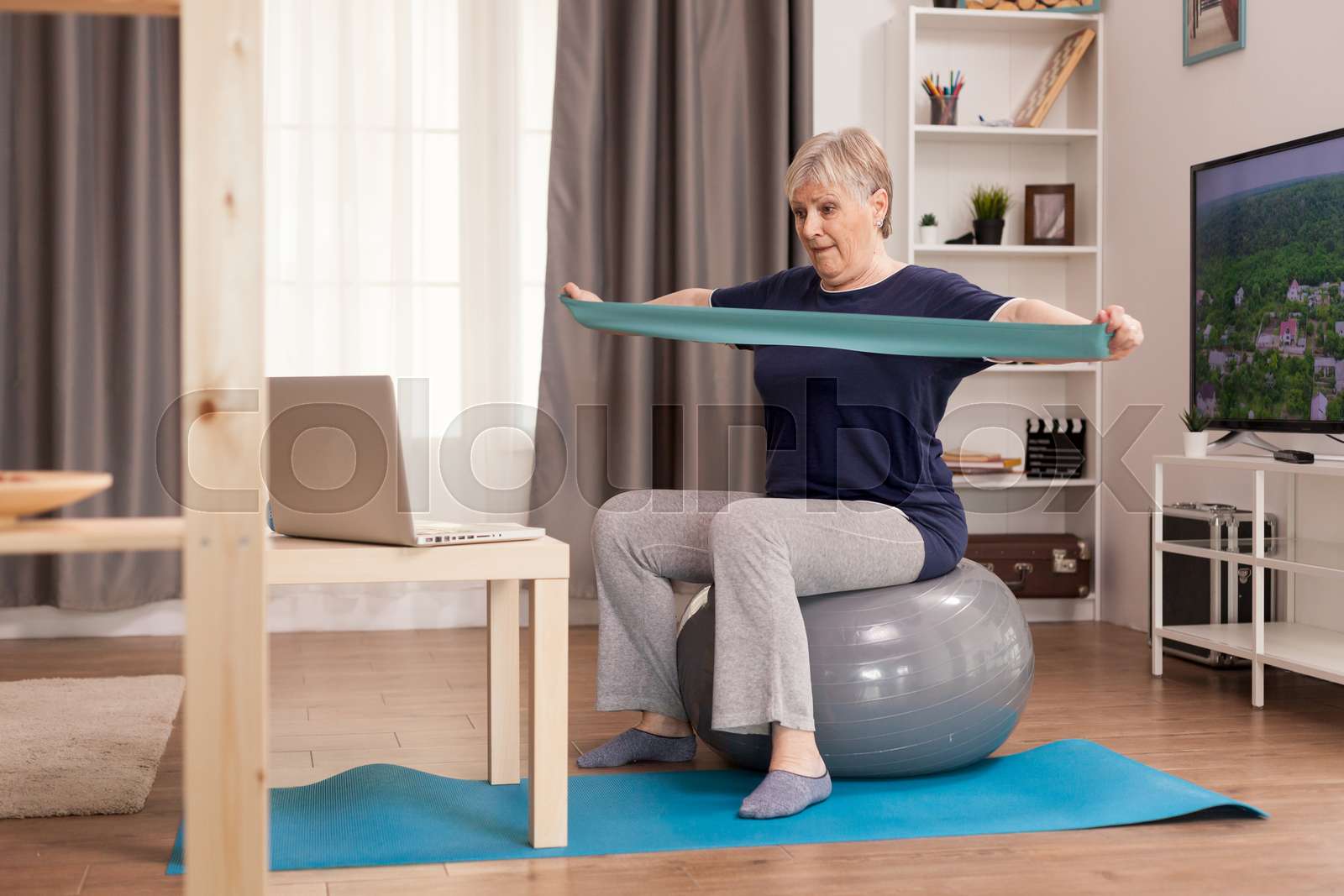 60 years old woman exercising | Stock image | Colourbox