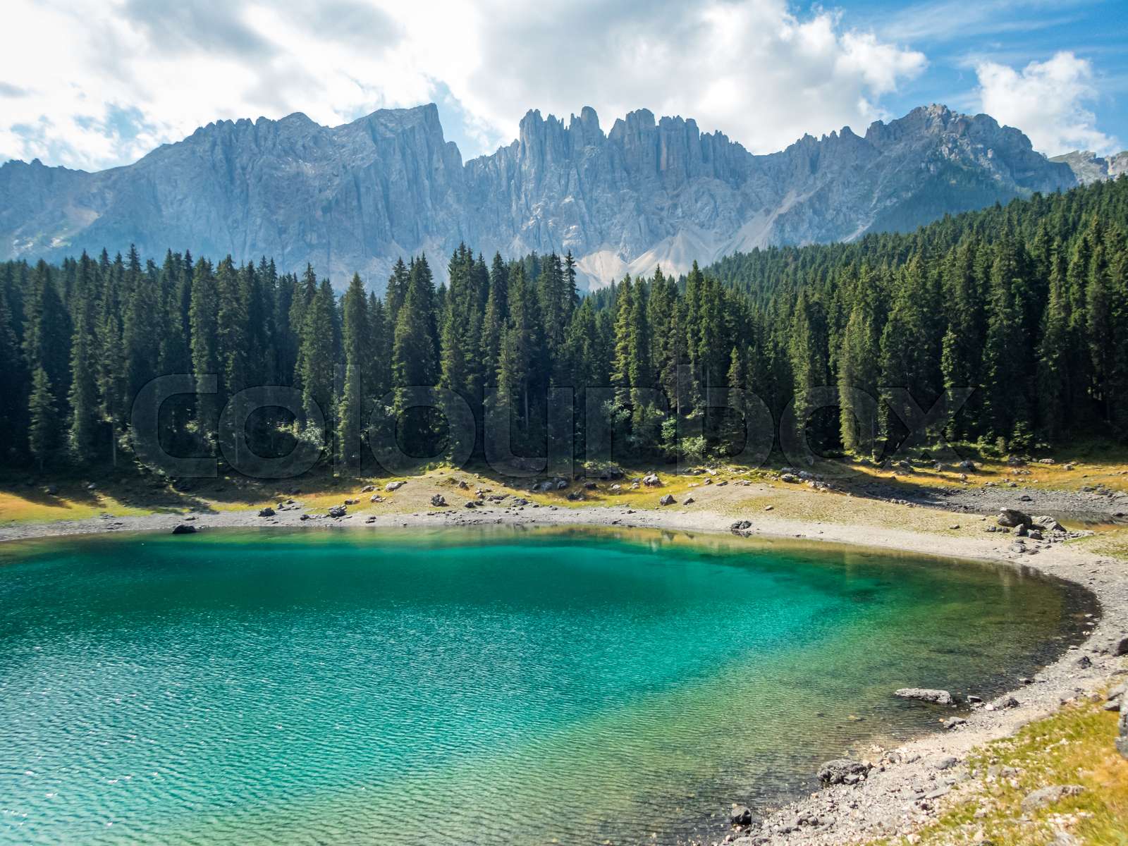 Karersee below the Karerpass at the foot of the Latemar massif | Stock ...