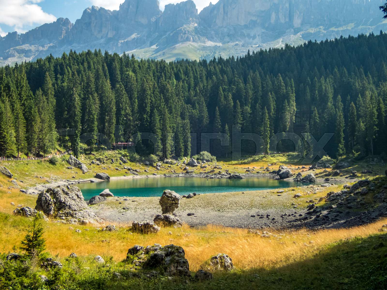 Karersee below the Karerpass at the foot of the Latemar massif | Stock ...