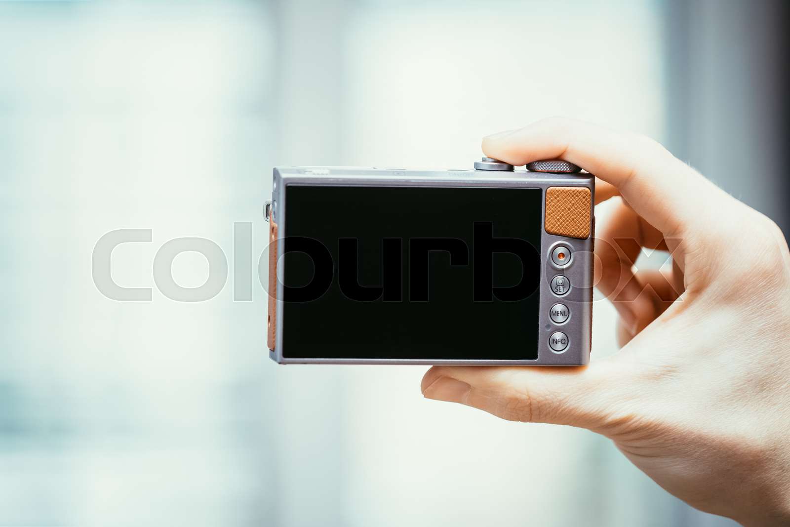 Backside of a modern digital camera, black screen | Stock image | Colourbox