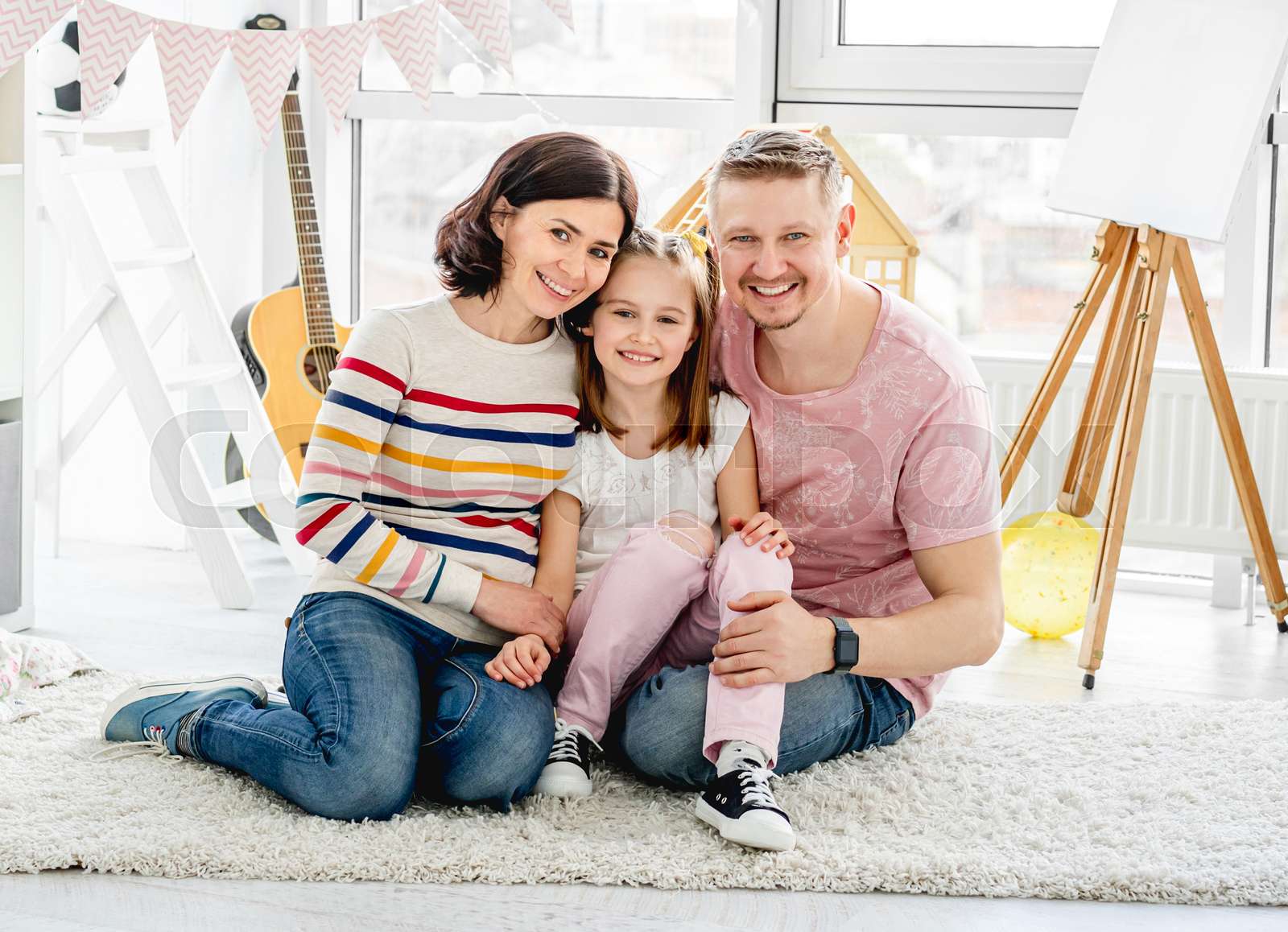 Happy family in light room | Stock image | Colourbox
