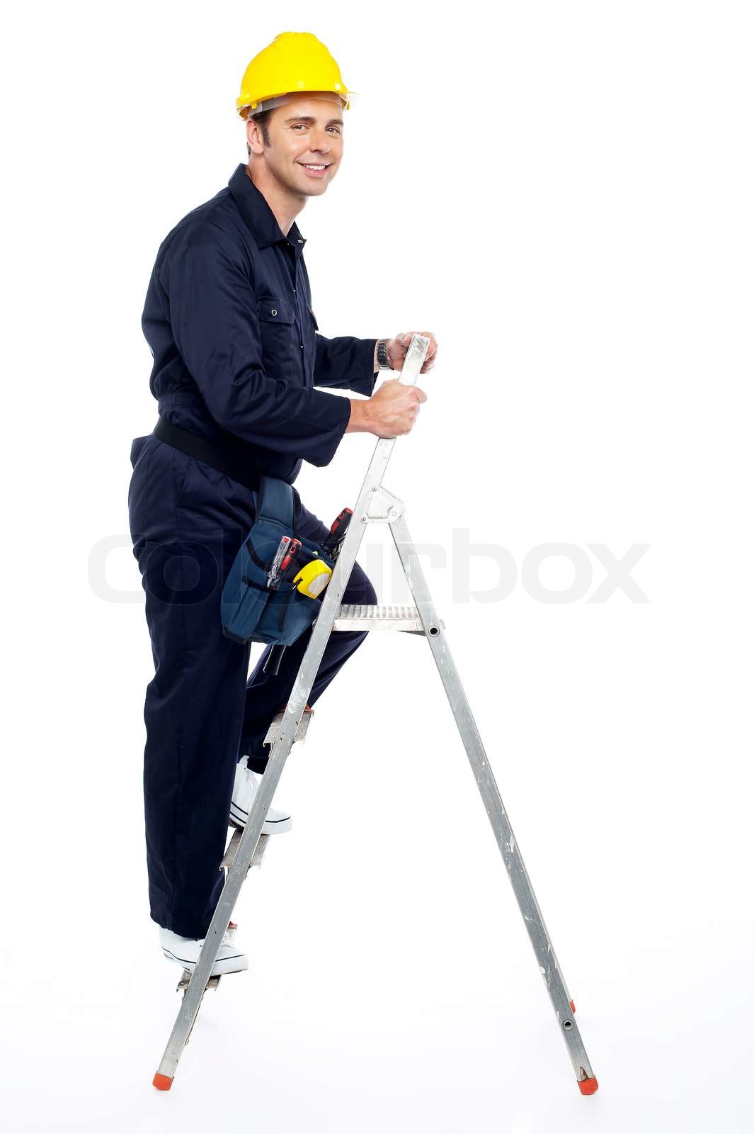 Industrial employee stepping up the ladder | Stock image | Colourbox
