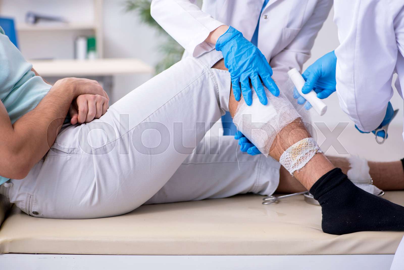 Young leg injured man in the hospital | Stock image | Colourbox