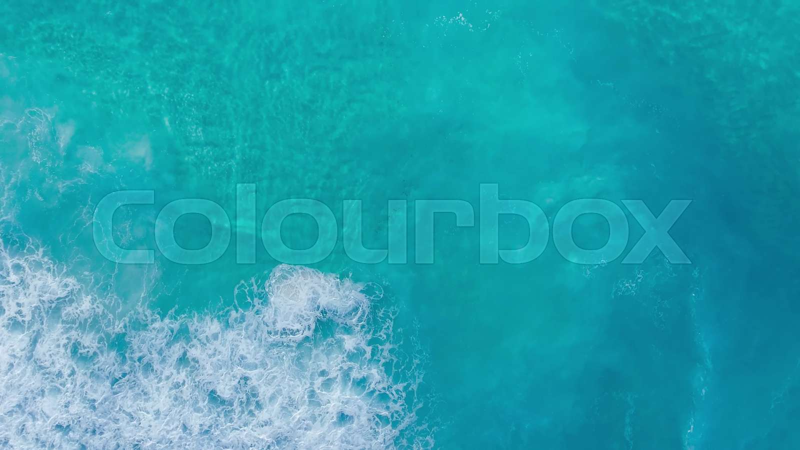 Amazing overhead aerial view of island shoreline with waves along the ...