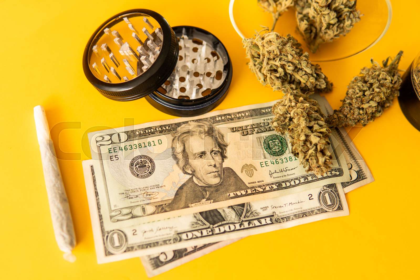 Marijuana weed bud and grinder. Marijuana bud and banknotes of dollars ...