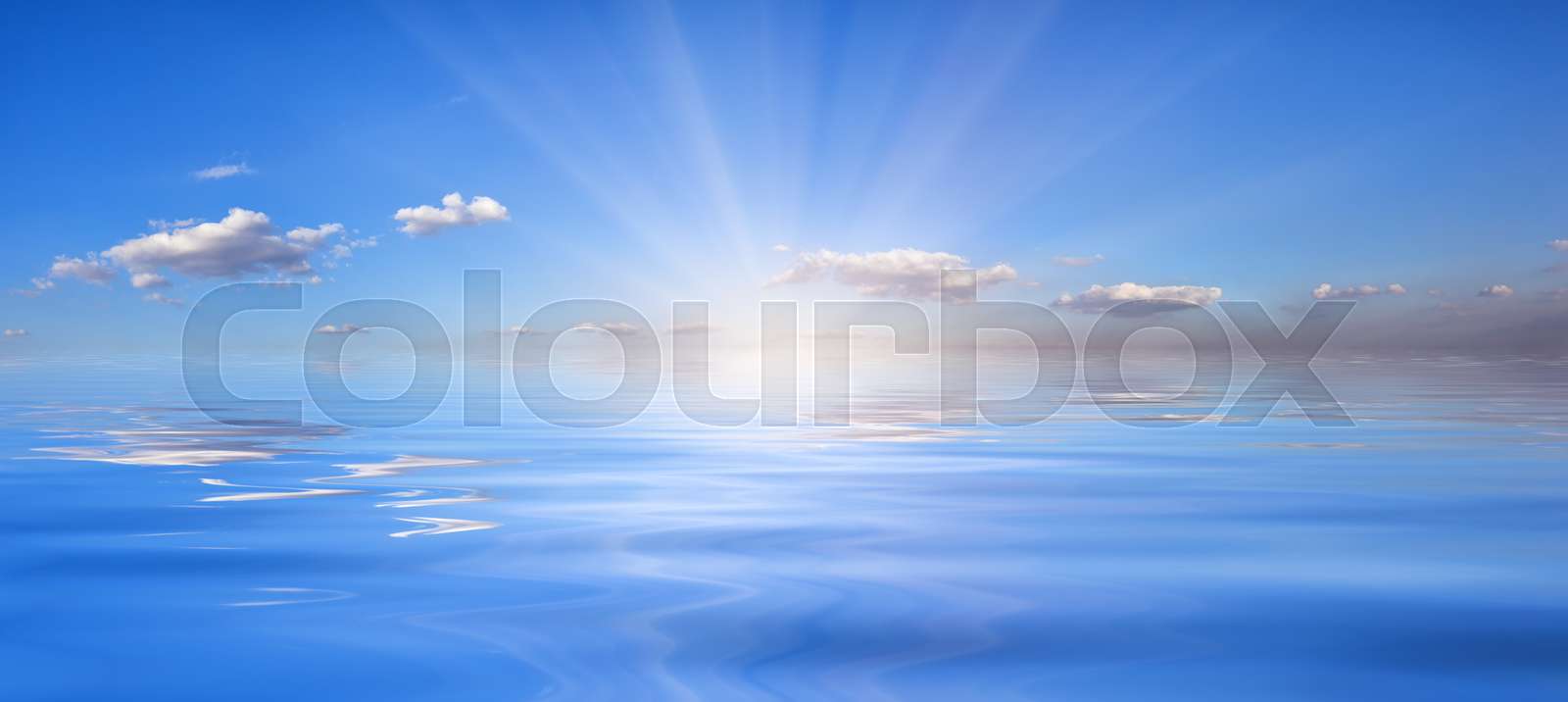 Blue sky with sun over the water | Stock image | Colourbox