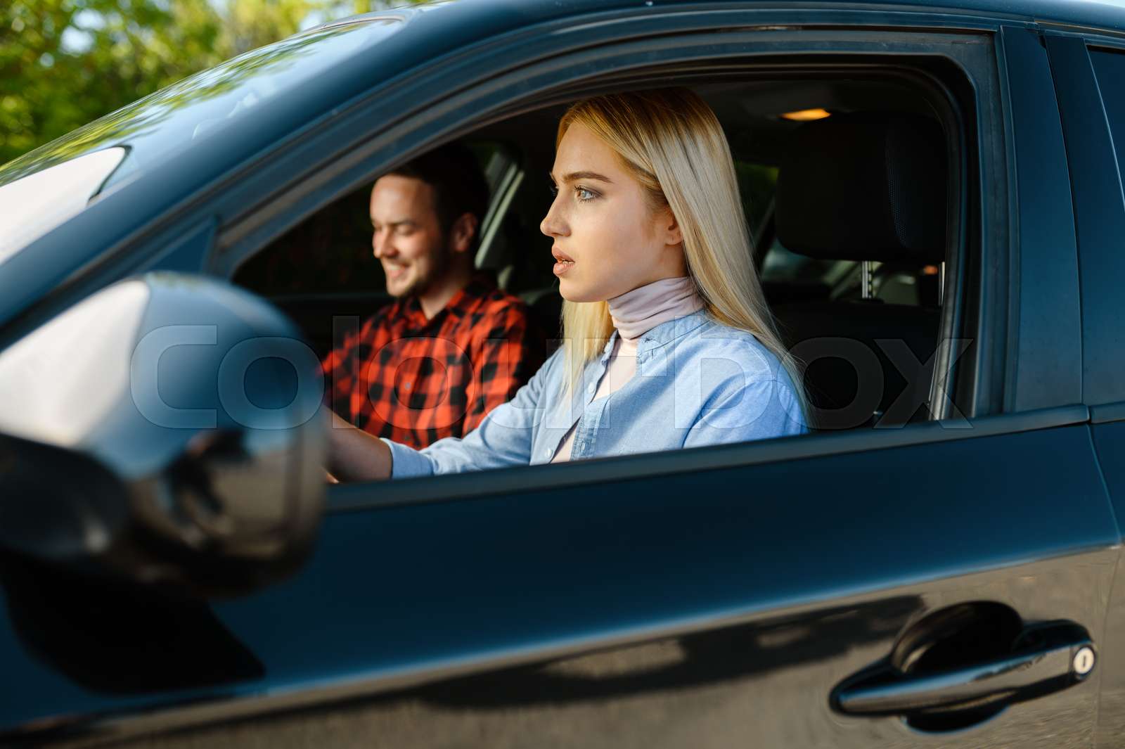 Student and male instructor in car, driving school | Stock image ...
