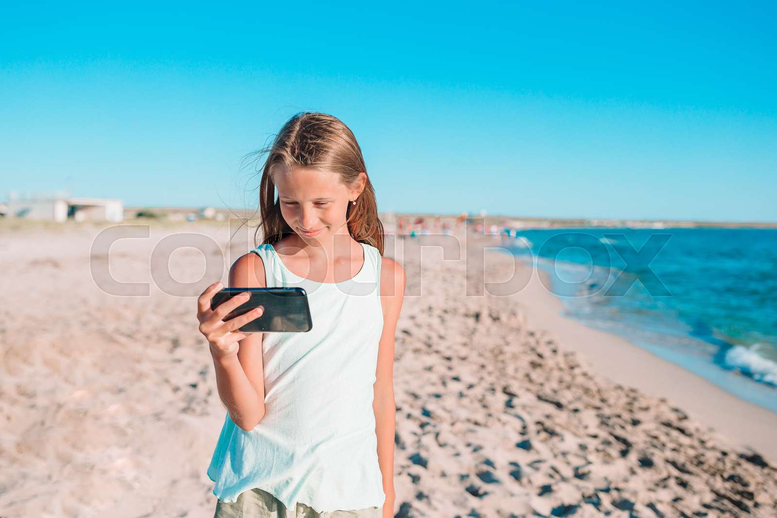 Adorable little girl at beach during summer vacation | Stock image ...