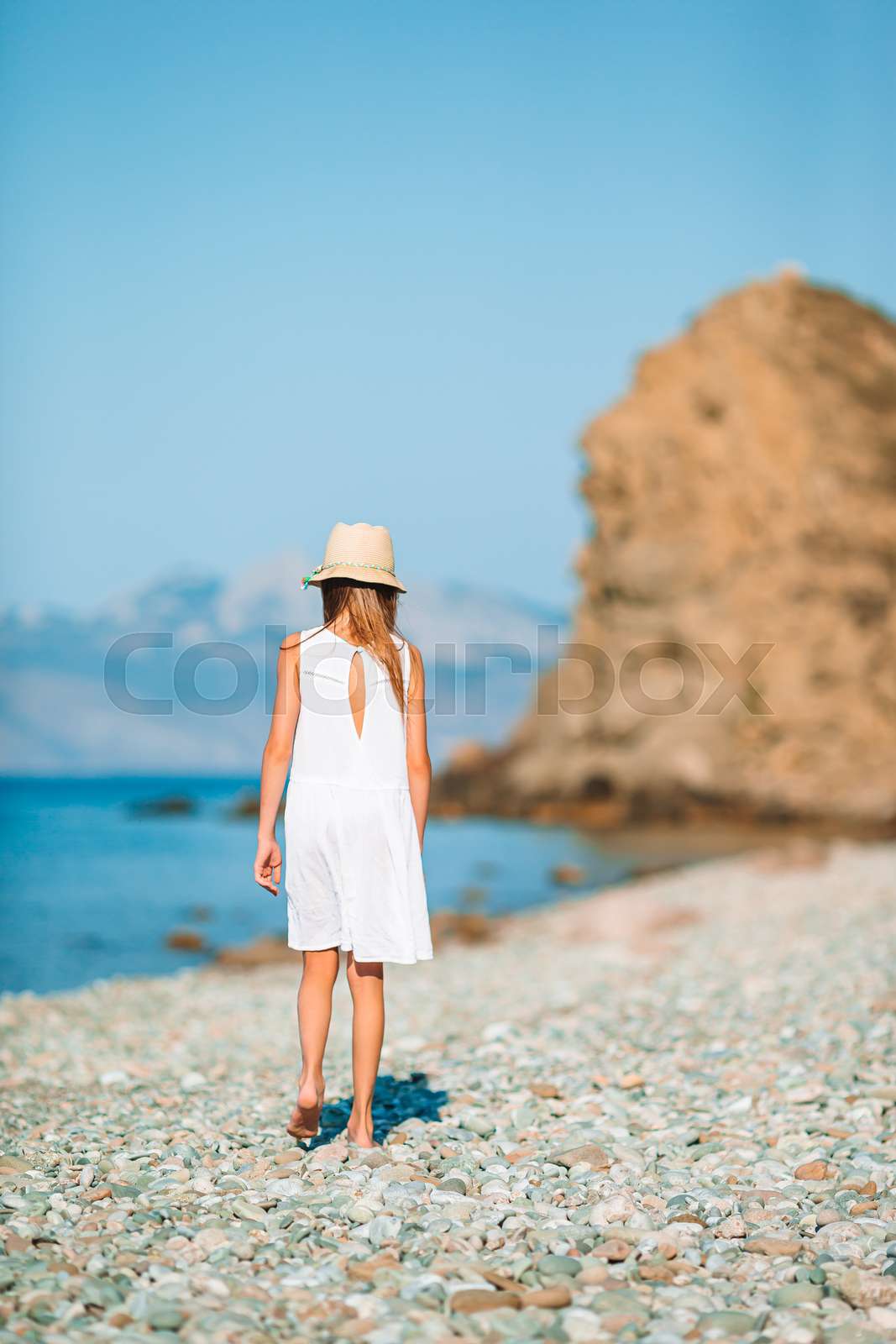 Cute little girl at beach during summer vacation | Stock image | Colourbox