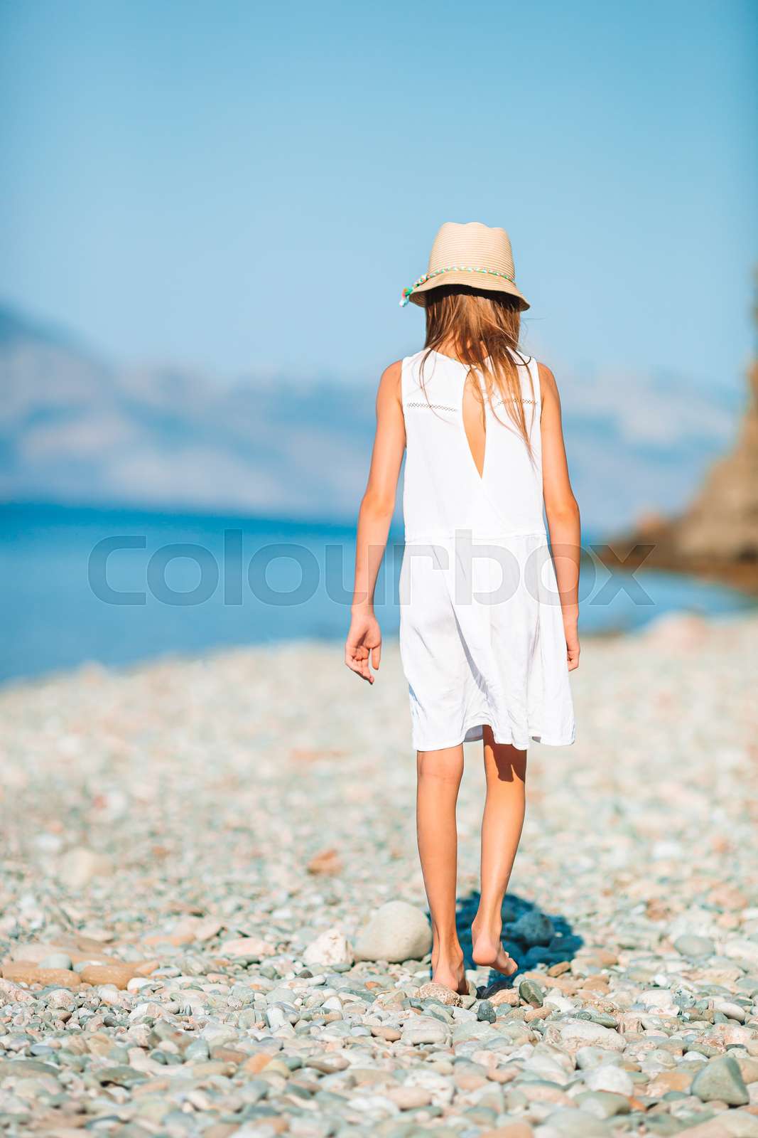 Cute little girl at beach during summer vacation | Stock image | Colourbox