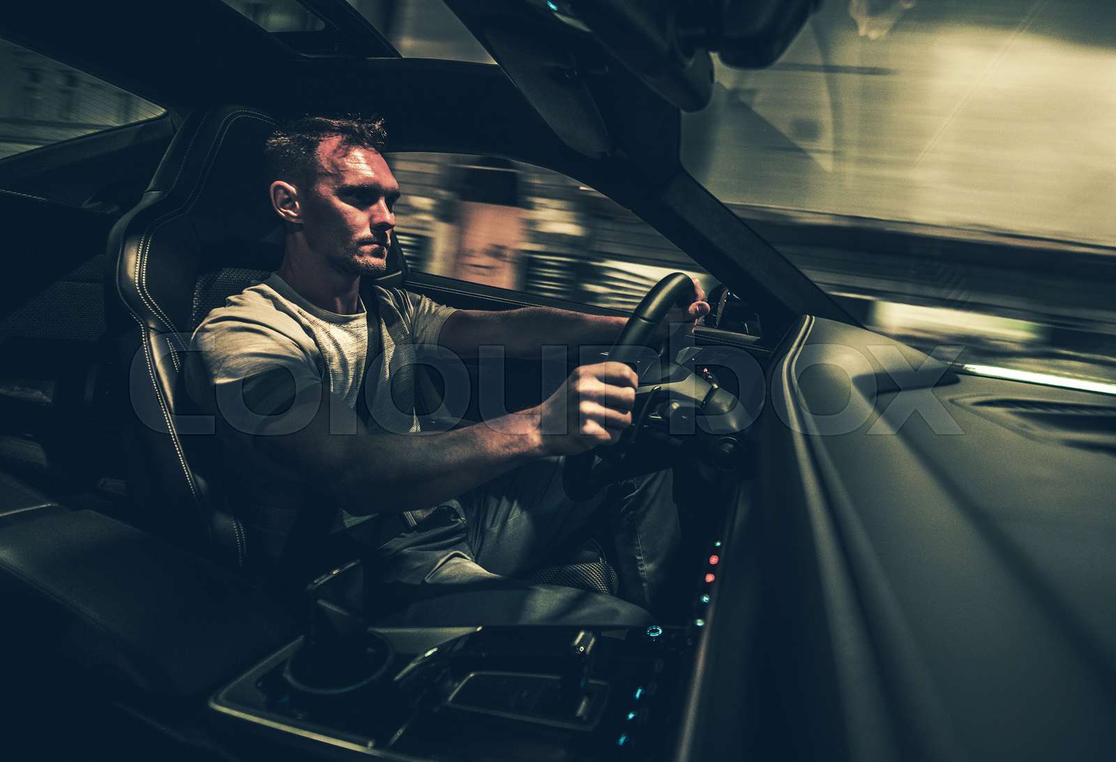Man Driving Exotic Car At Night. | Stock image | Colourbox