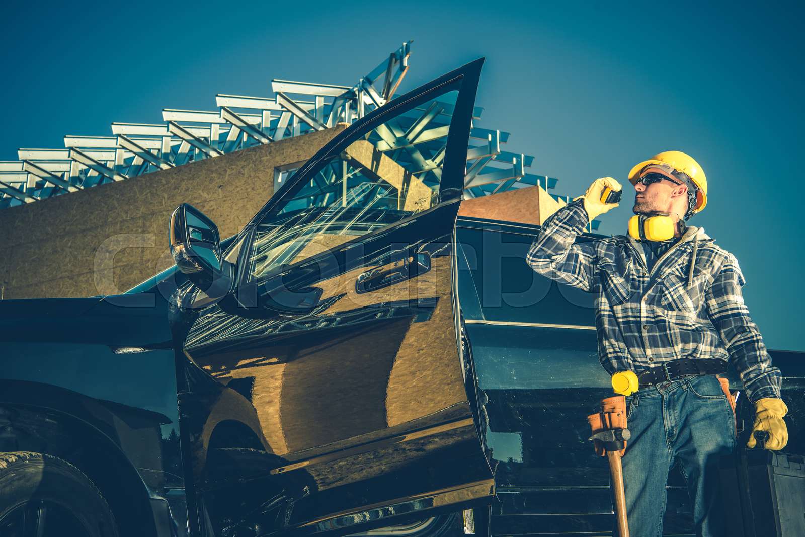 Construction Worker Talking On Radio. | Stock image | Colourbox
