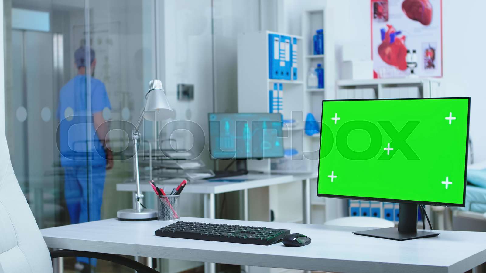Monitor with green screen in hospital | Stock image | Colourbox
