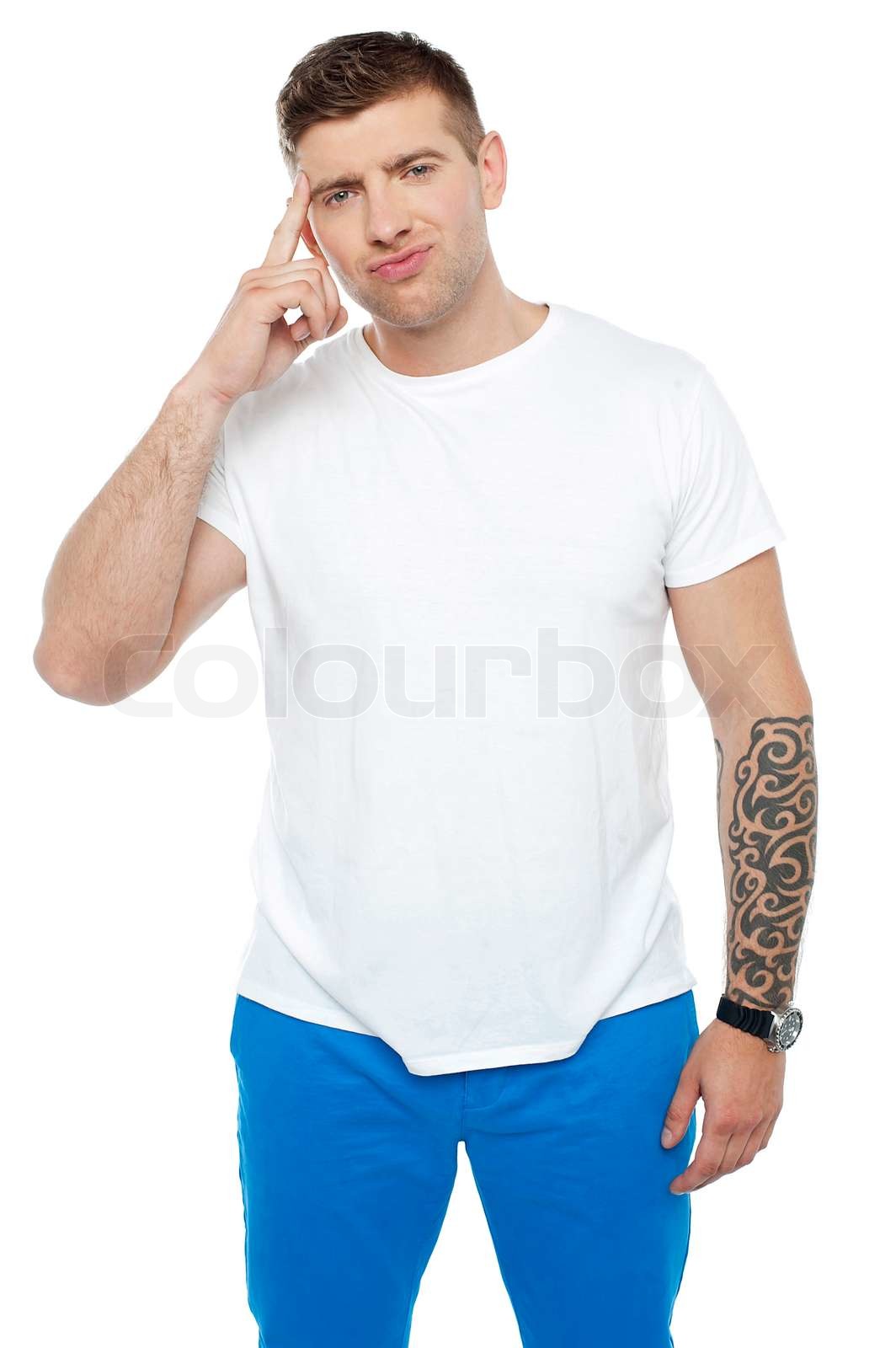 Young smart guy thinking hard | Stock image | Colourbox