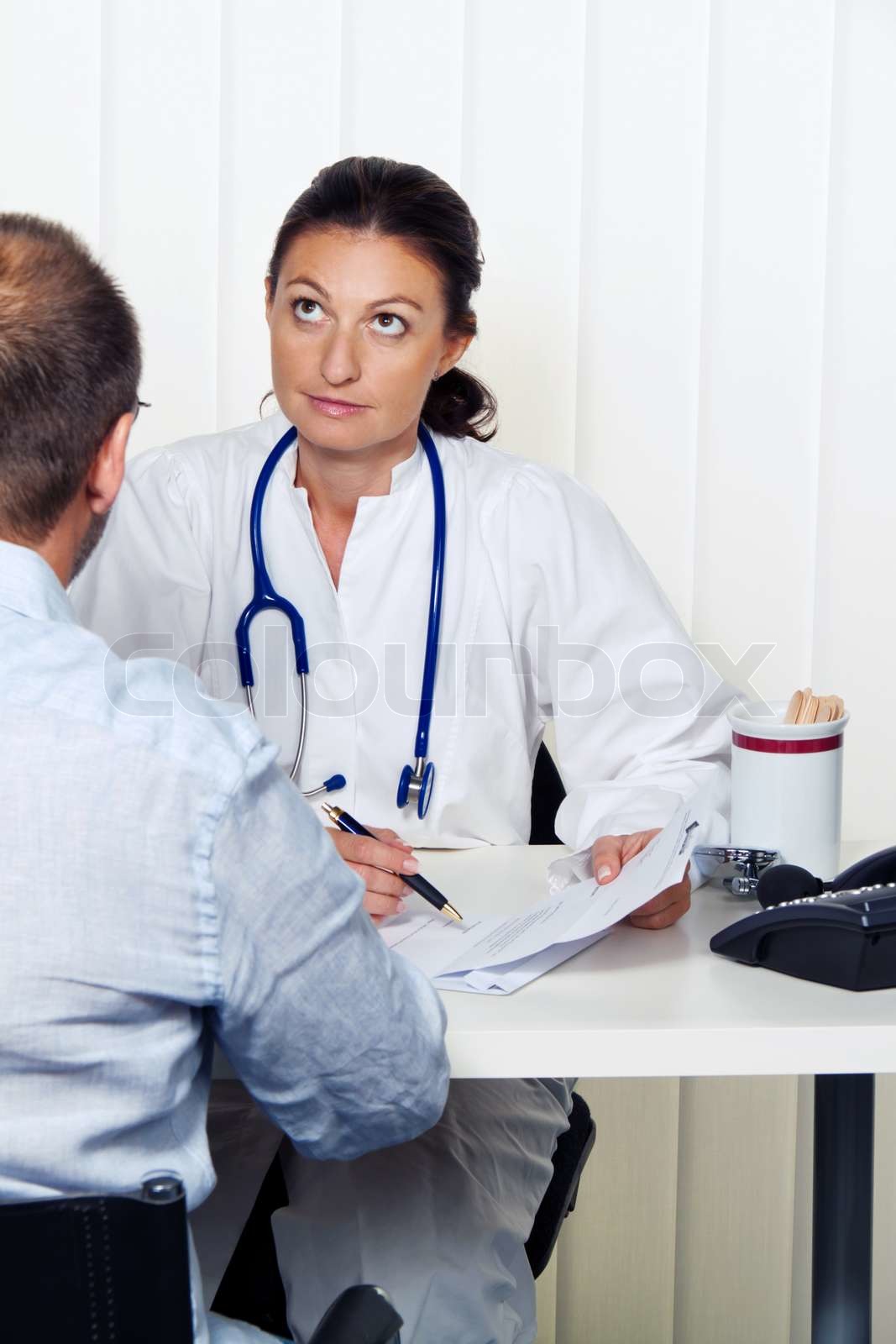 doctors in medical practice with patients conversation | Stock image ...