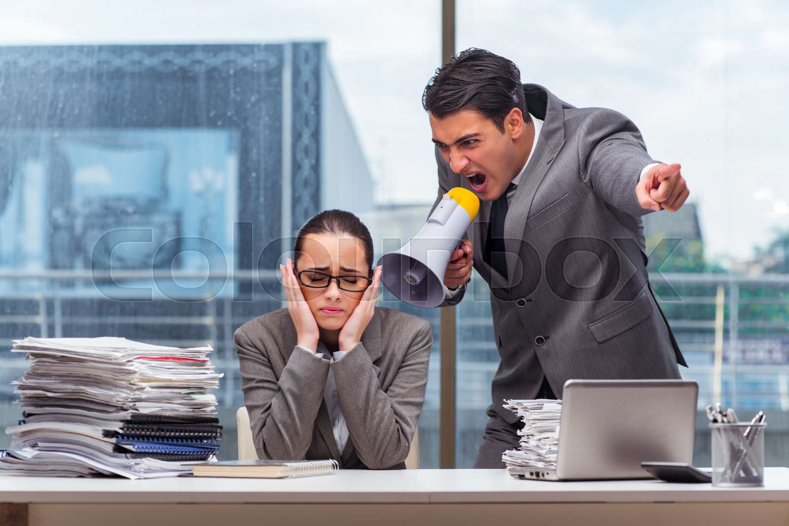 Boss yelling at his team member | Stock image | Colourbox