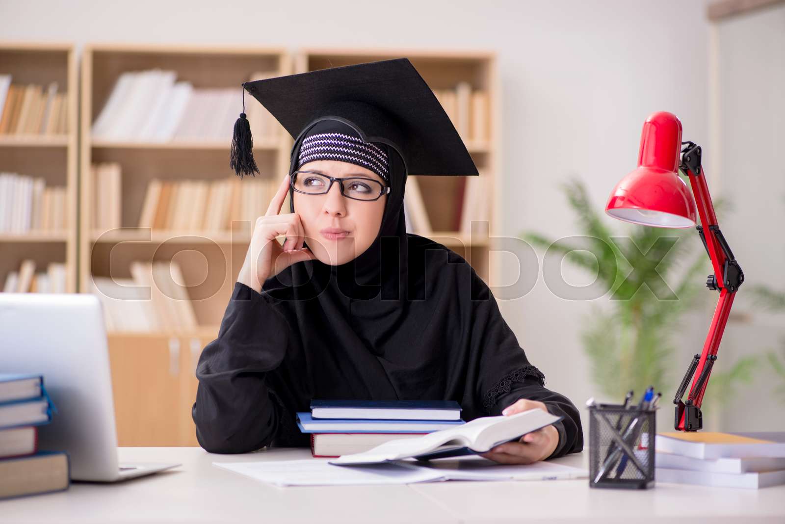Muslim girl in hijab studying preparing for exams | Stock image | Colourbox