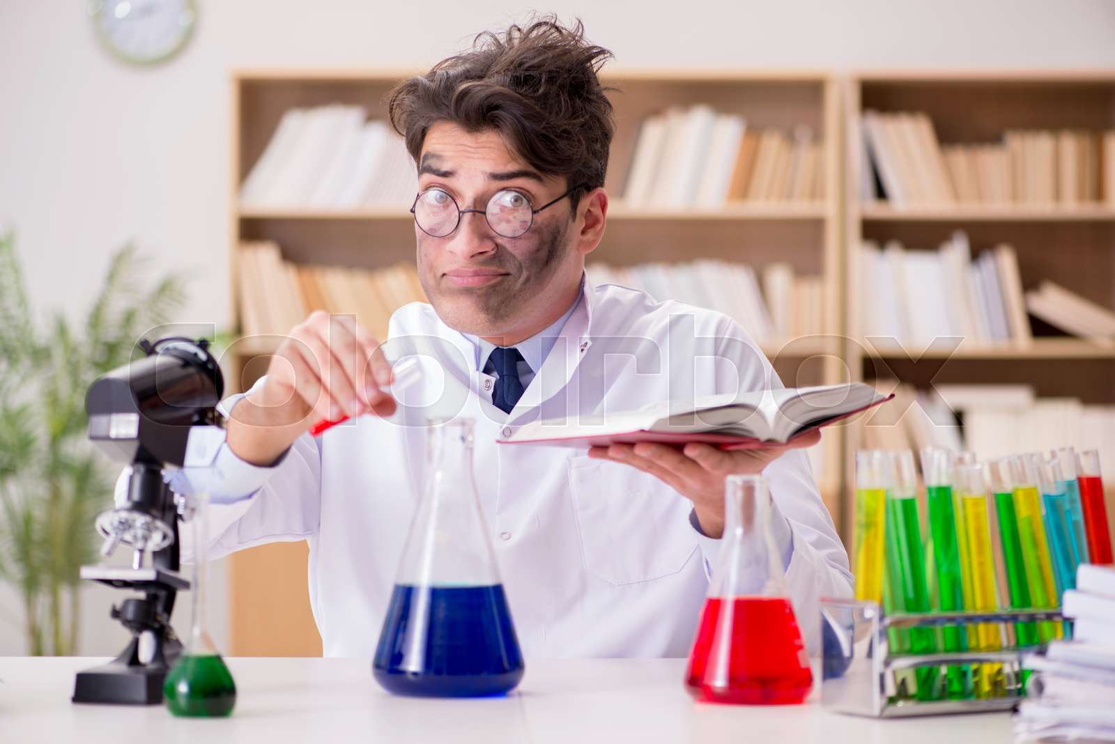 Mad crazy scientist doctor doing experiments in a laboratory | Stock ...