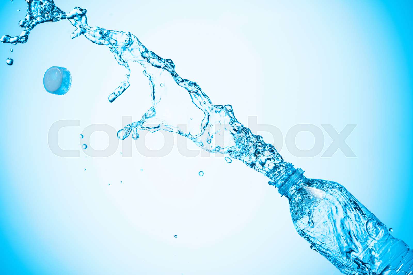 Water is poured out of a plastic bottle. | Stock image | Colourbox