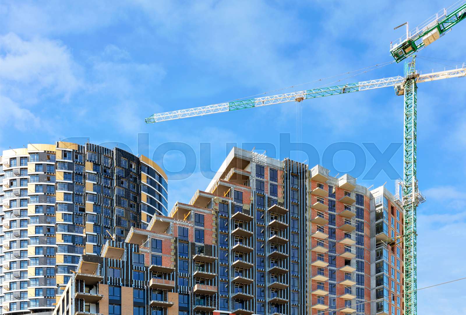 Construction site of a multi-storey residential complex with cascading ...
