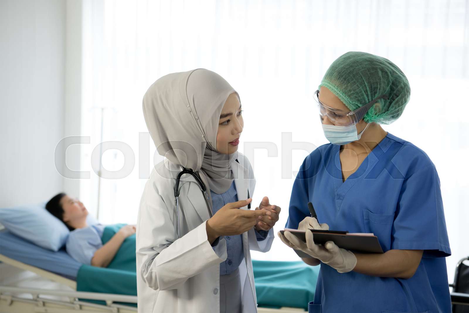 Doctor and Patient ,Face mask, COVID-19 | Stock image | Colourbox